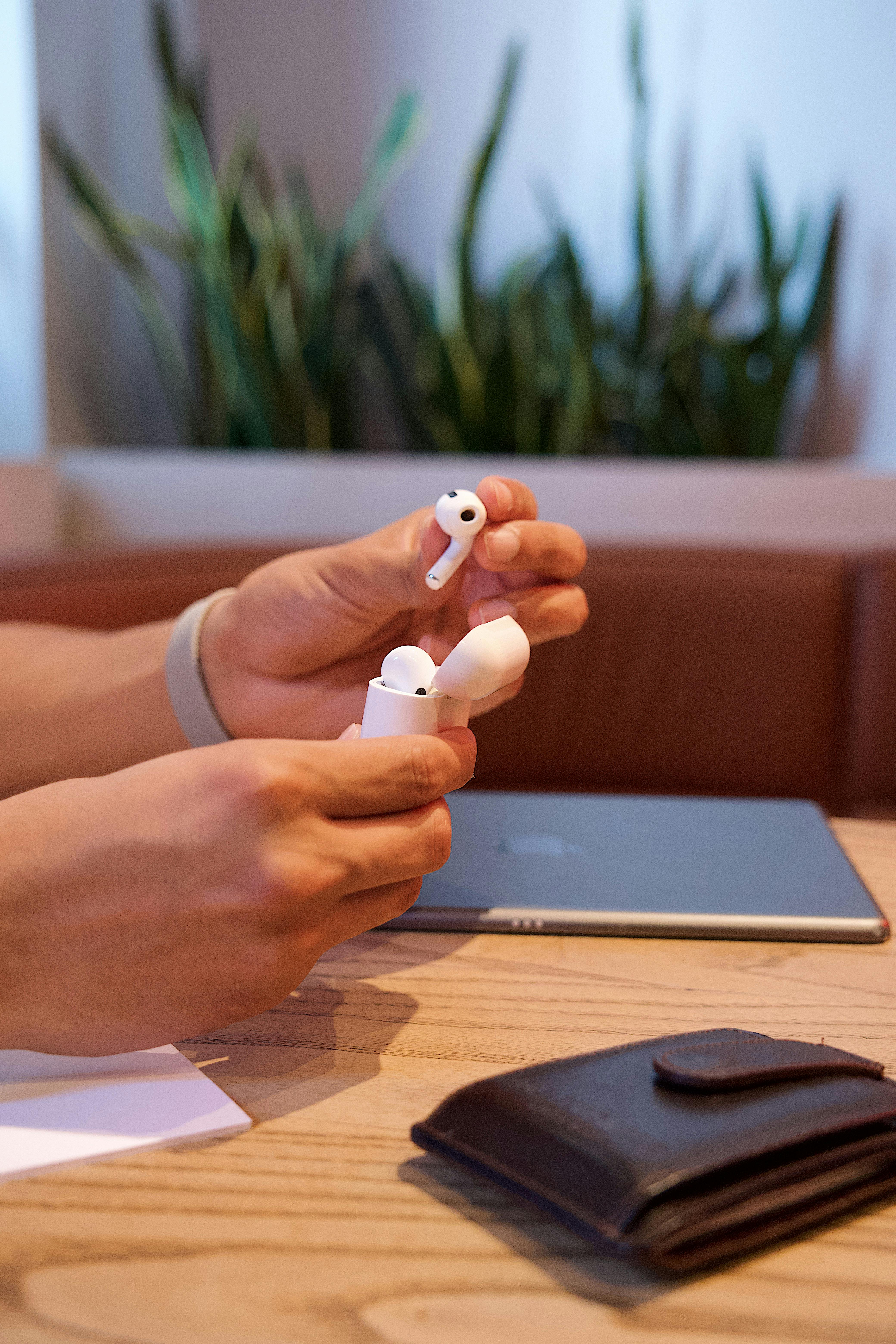 Man Hands Holding Airpods · Free Stock Photo