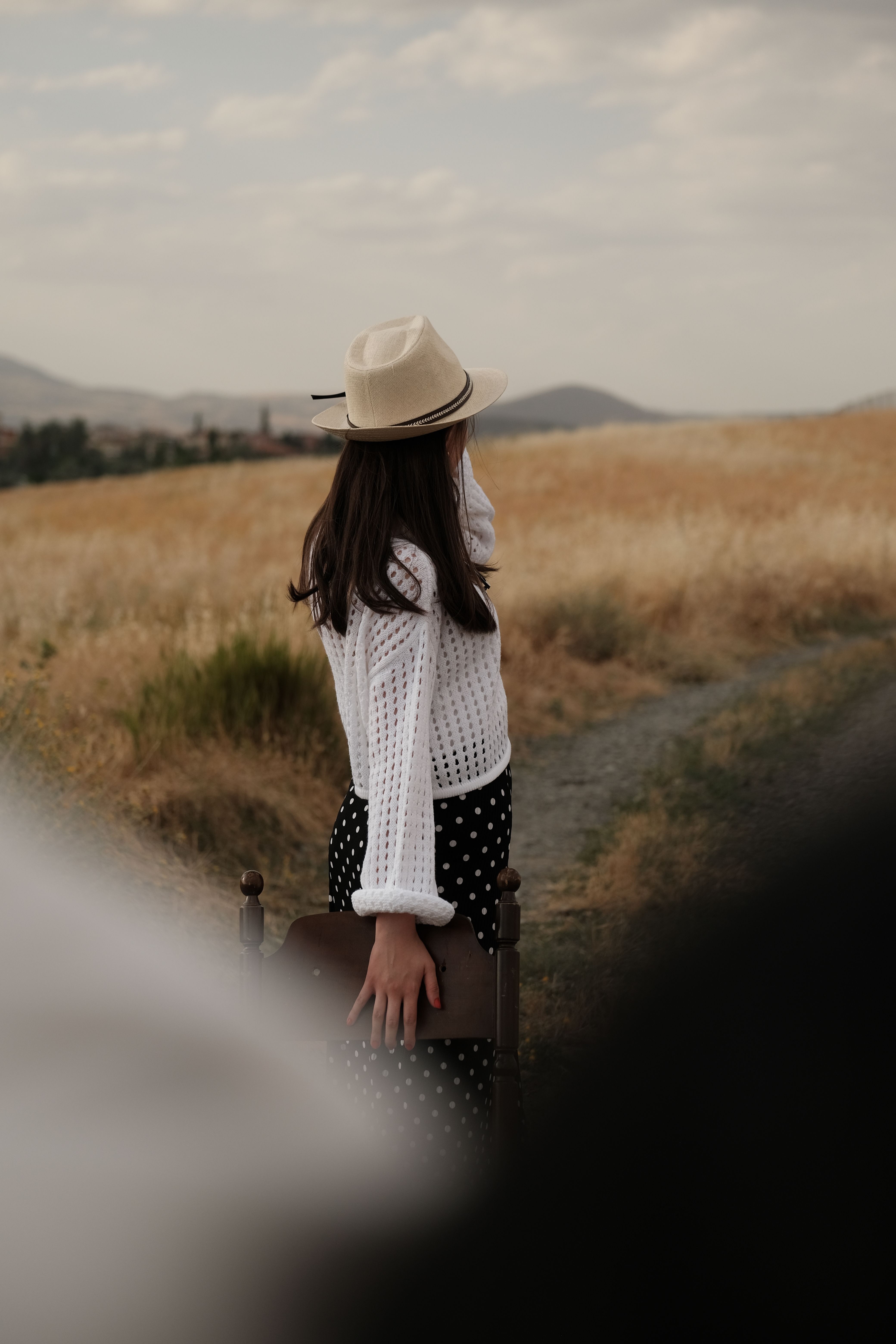 Girl in Straw Sunhat Touching Lavender Flowers · Free Stock Photo