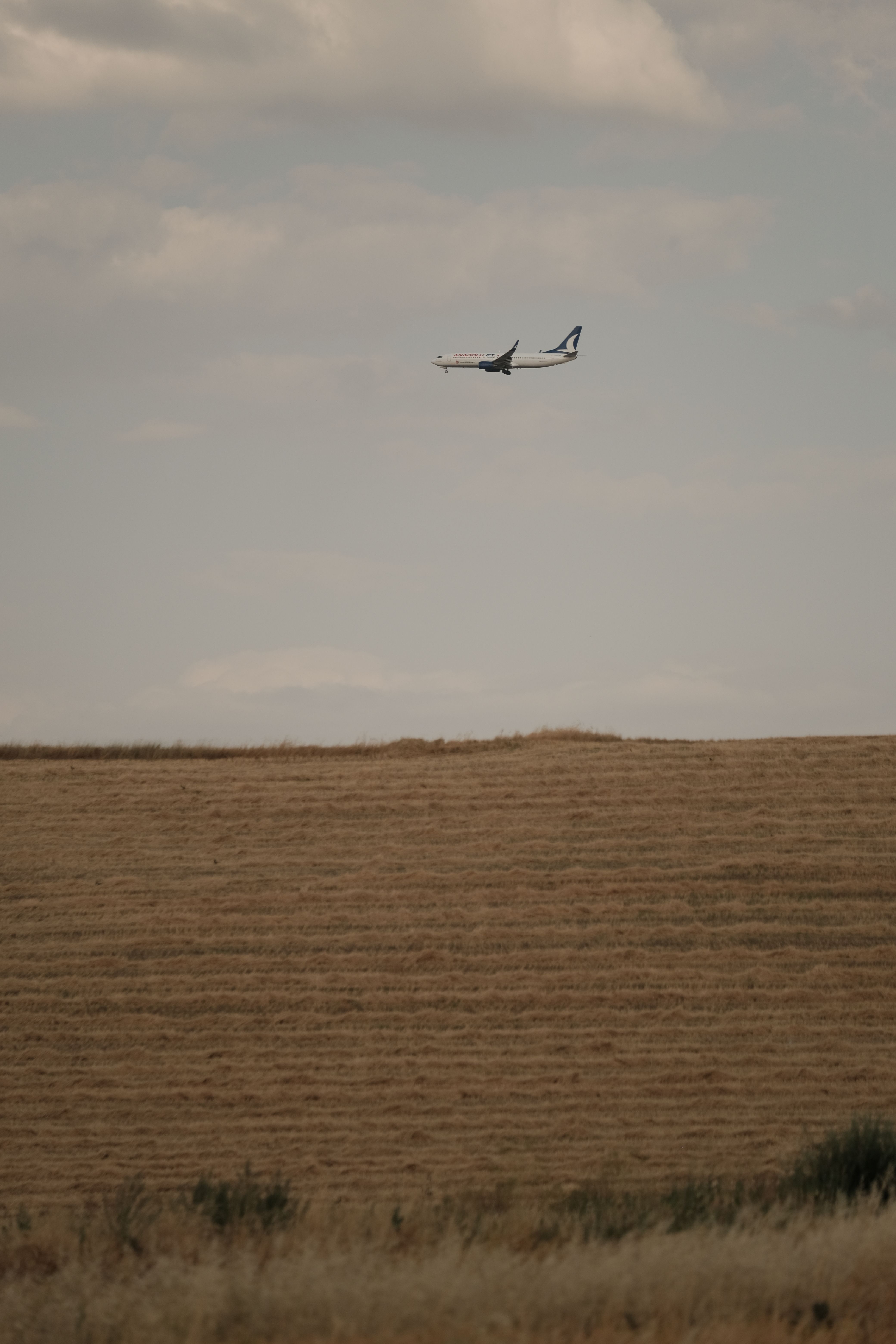 Airplane over Rural Field · Free Stock Photo