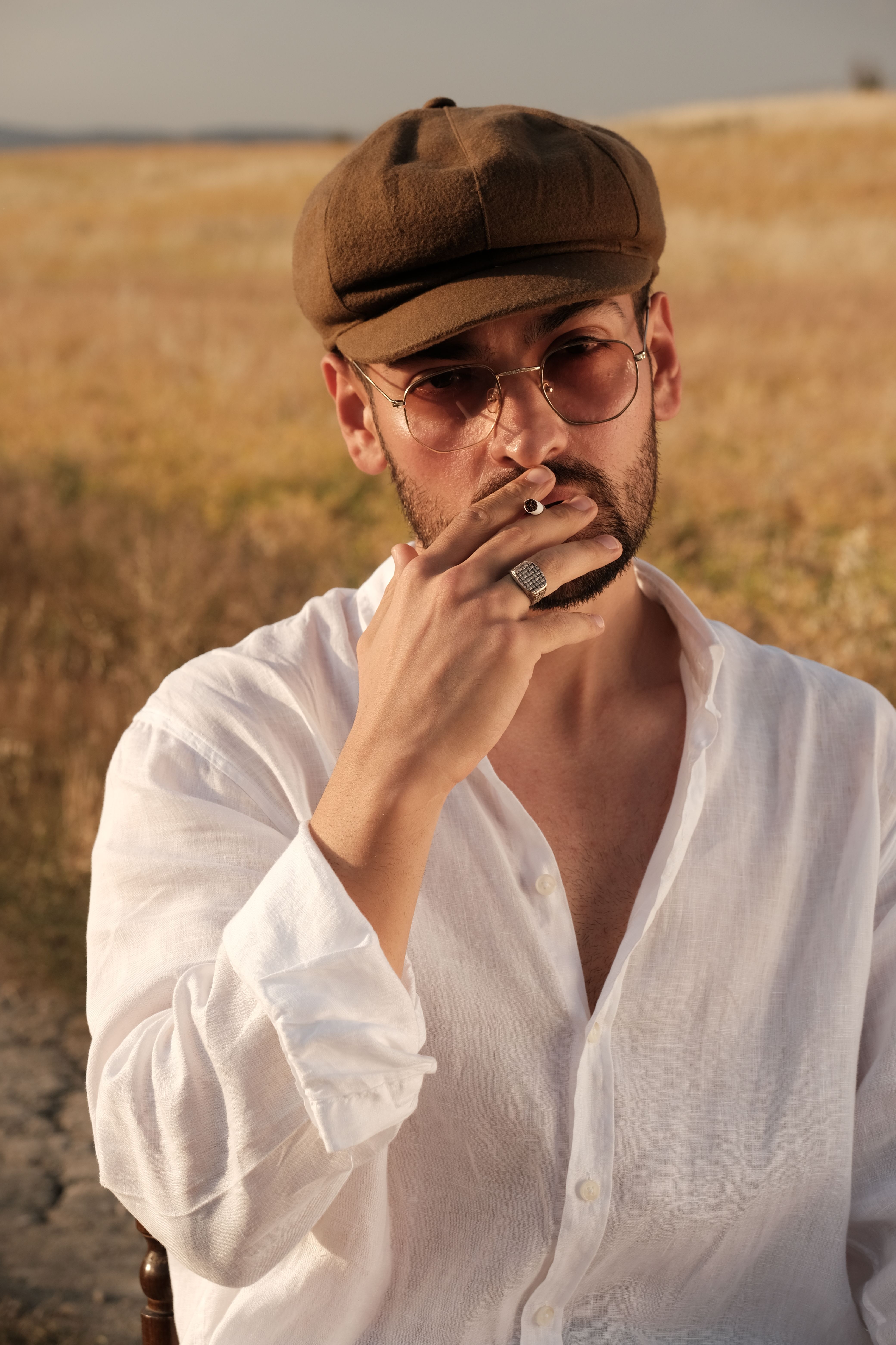 Man Smoking Cigarette at Sunset · Free Stock Photo