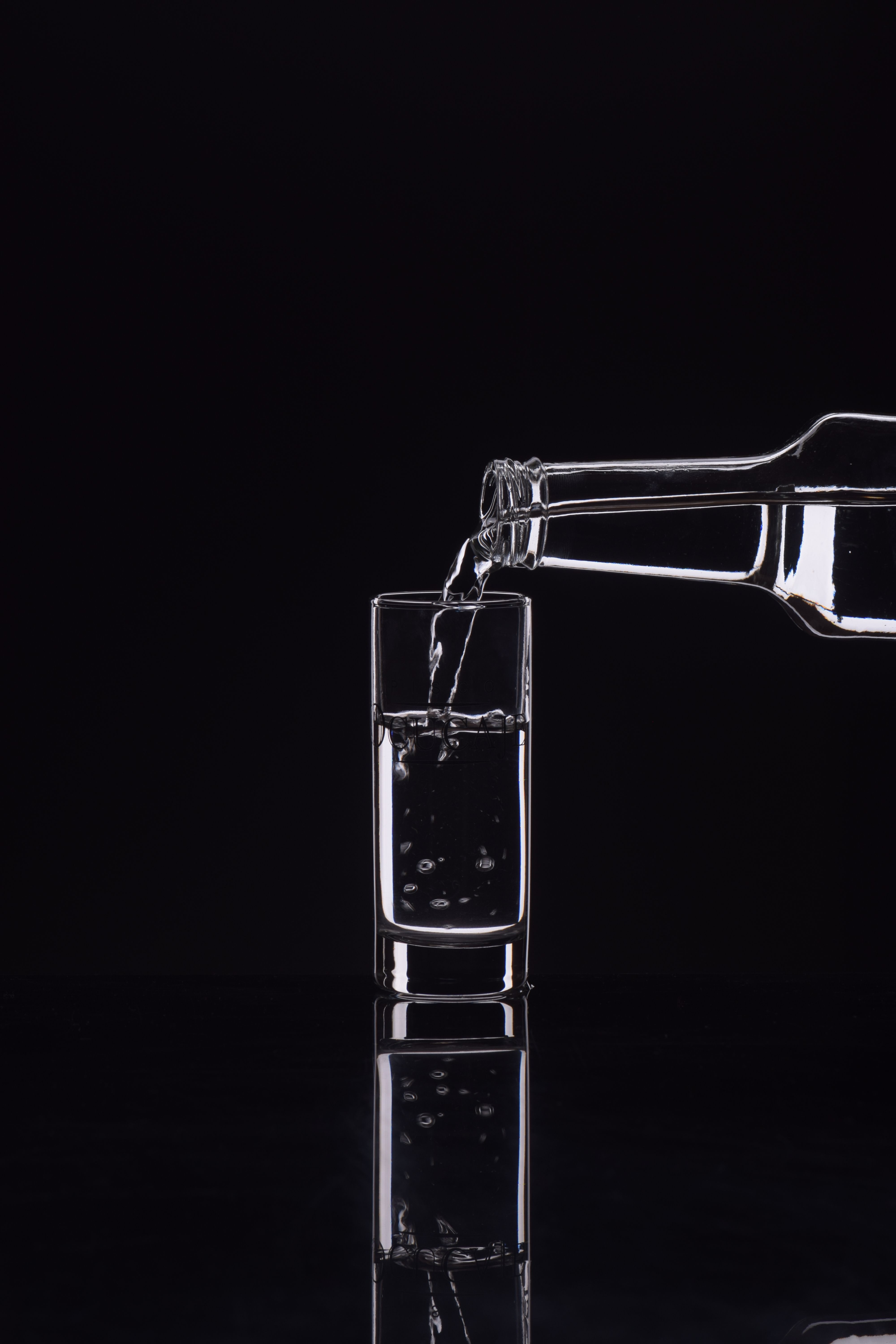 Pouring Liquid in a Glass From a Bottle · Free Stock Photo