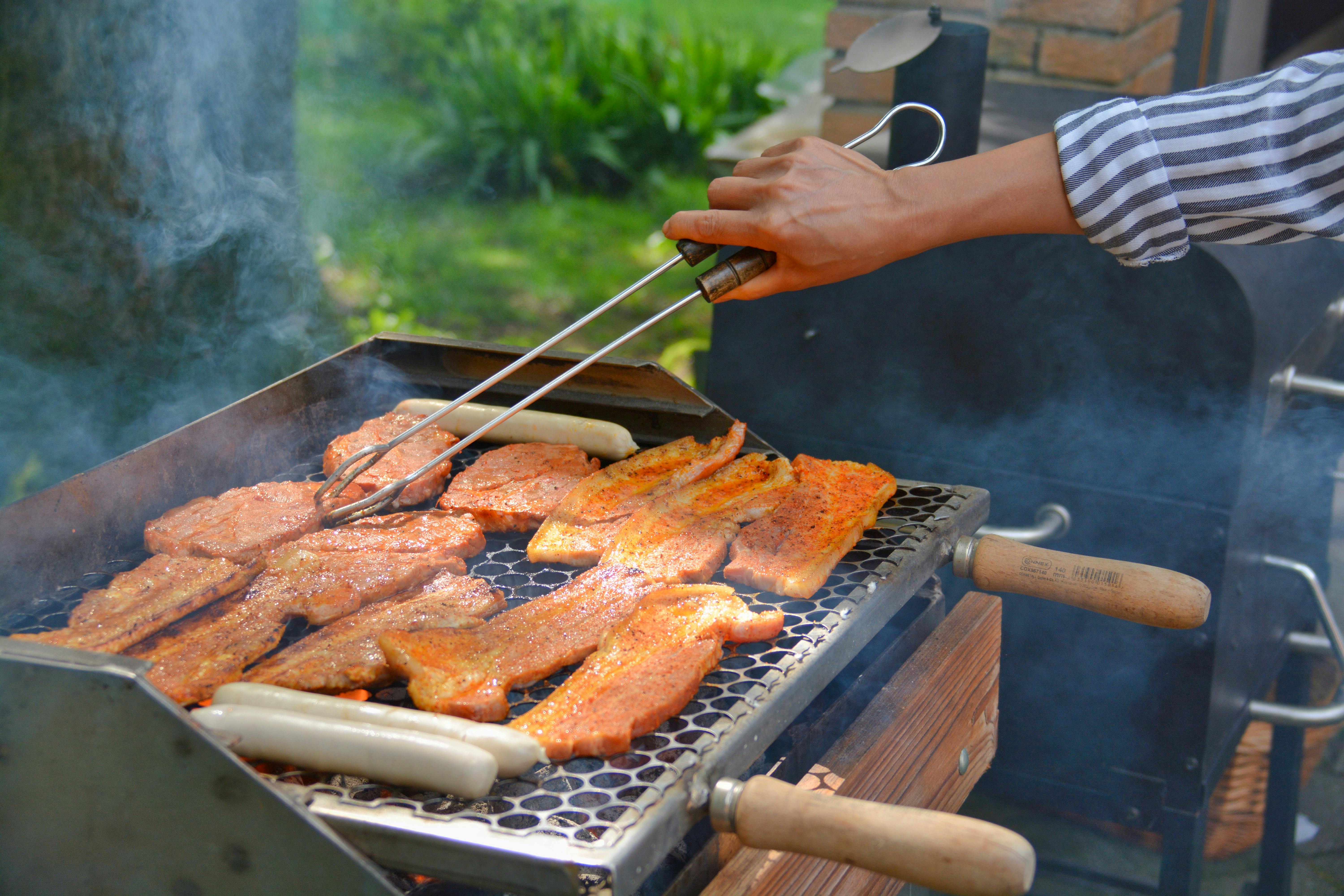 Man Grilling Meat on Barbecue · Free Stock Photo