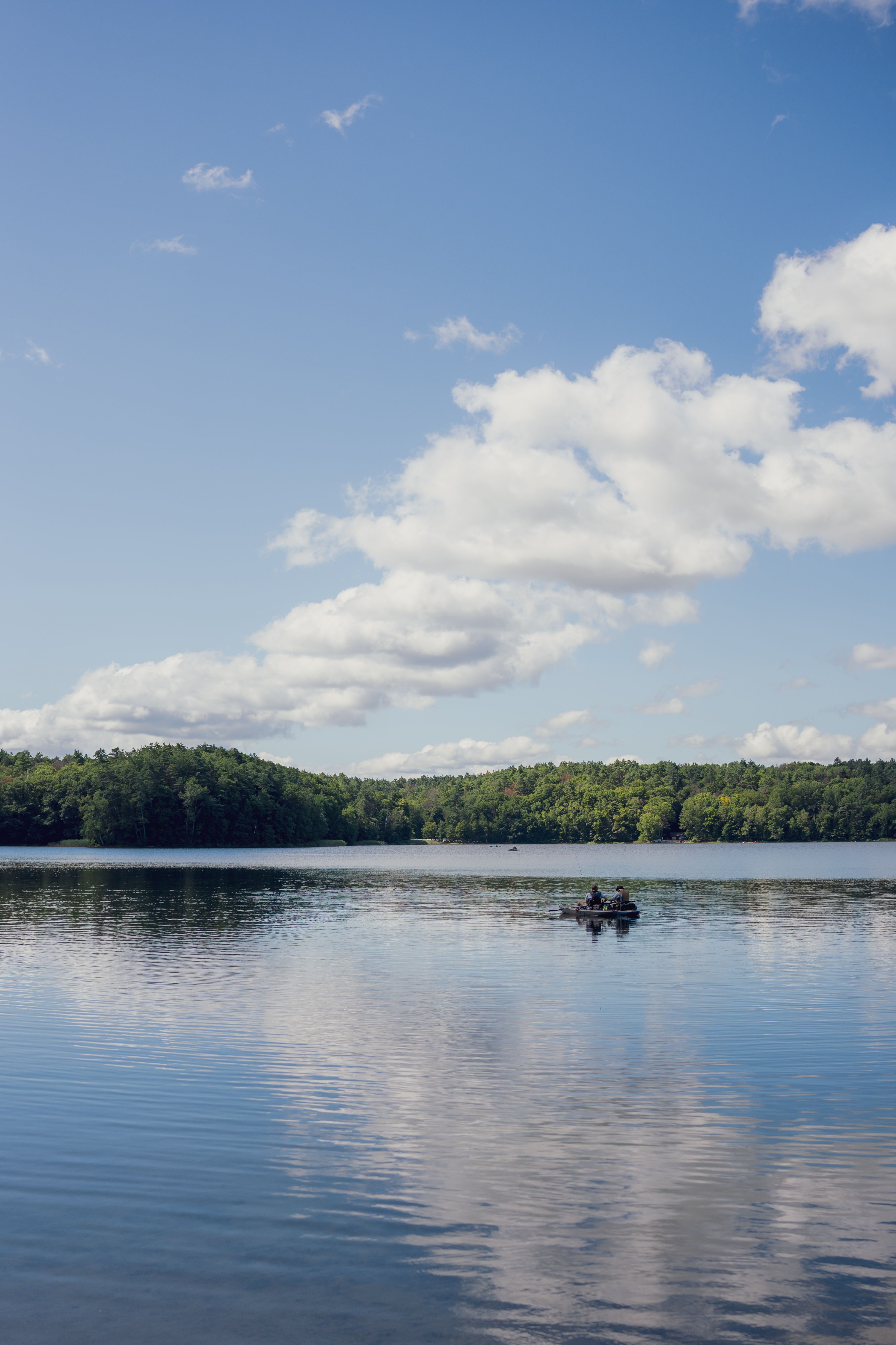 Motorboat on Lake at Sunset · Free Stock Photo