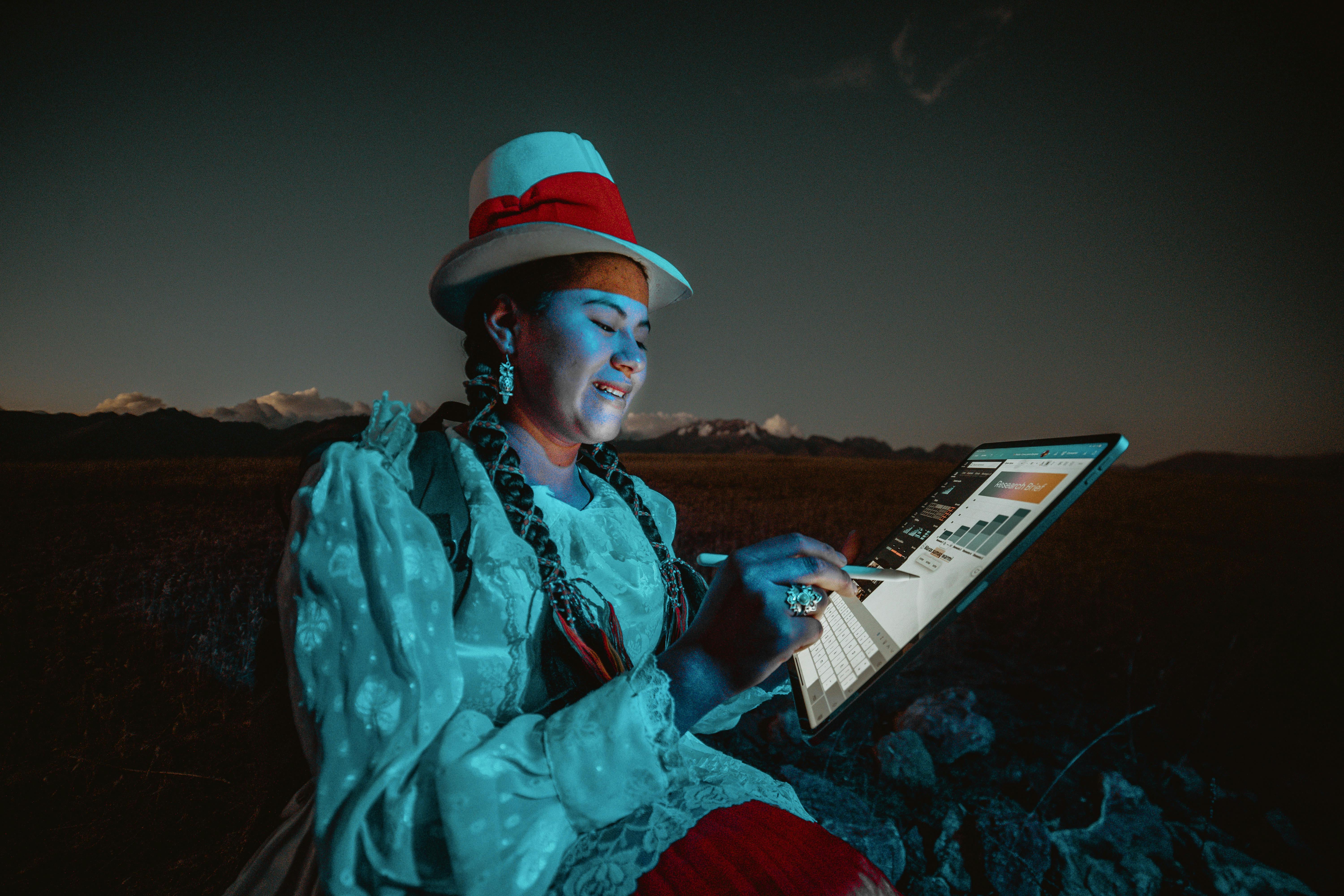 Smiling Peruvian Woman Using Tablet · Free Stock Photo