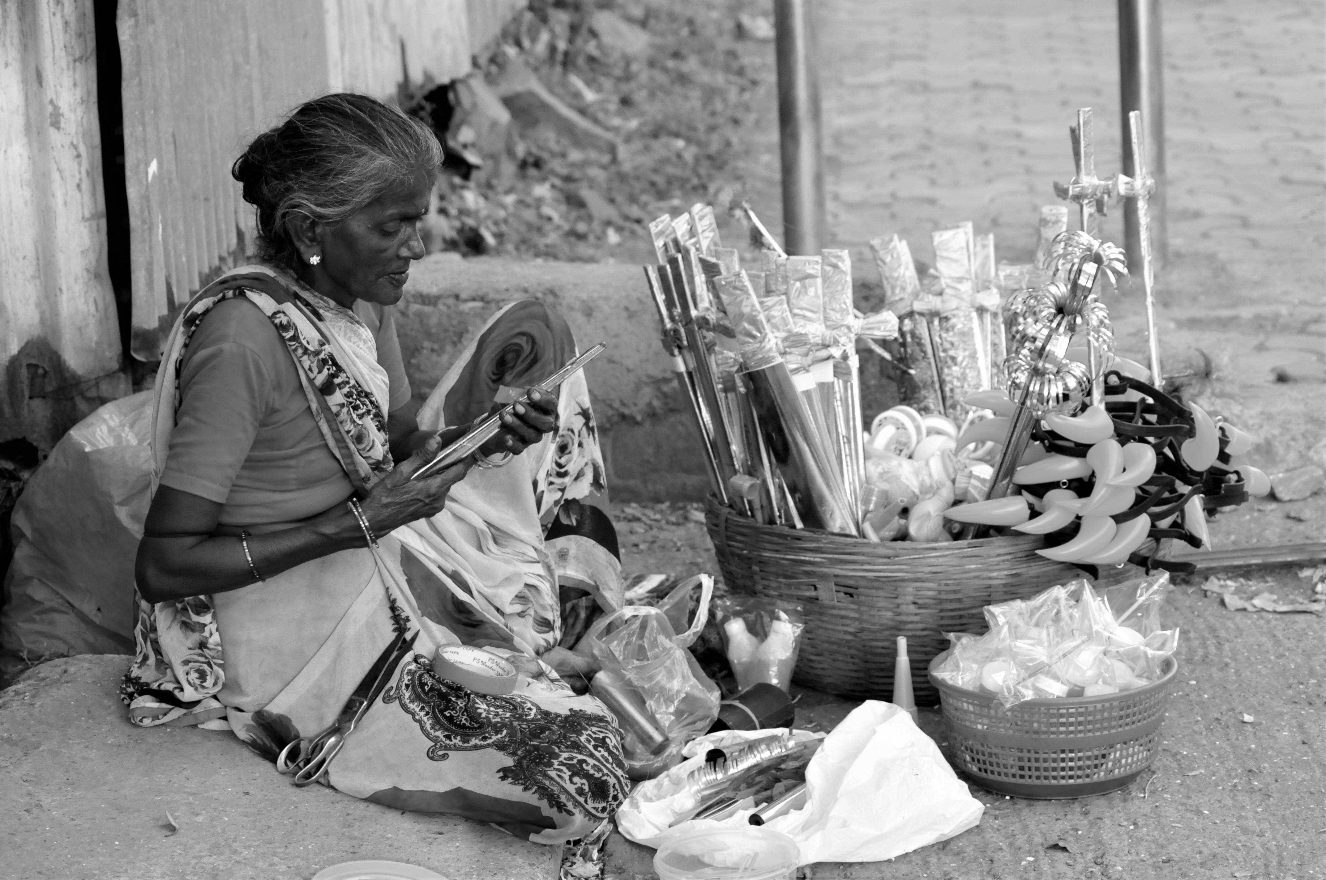 Elderly Woman Selling Items on the Street · Free Stock Photo