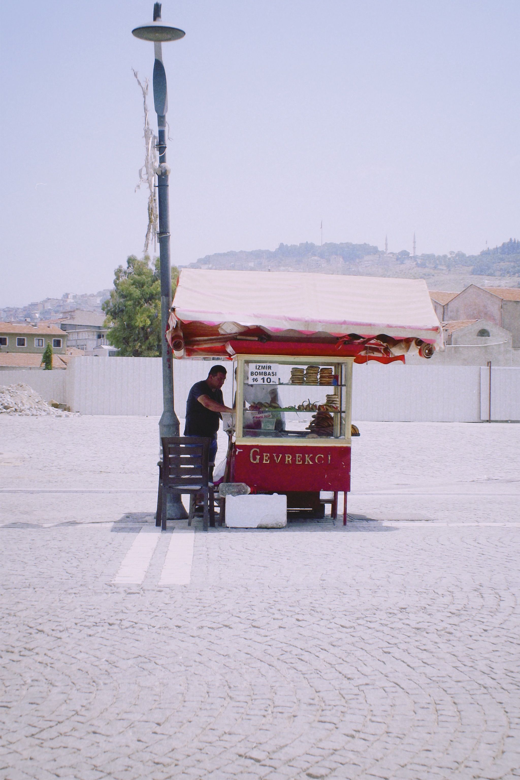 Street Food Stall next to Restaurant at Night · Free Stock Photo