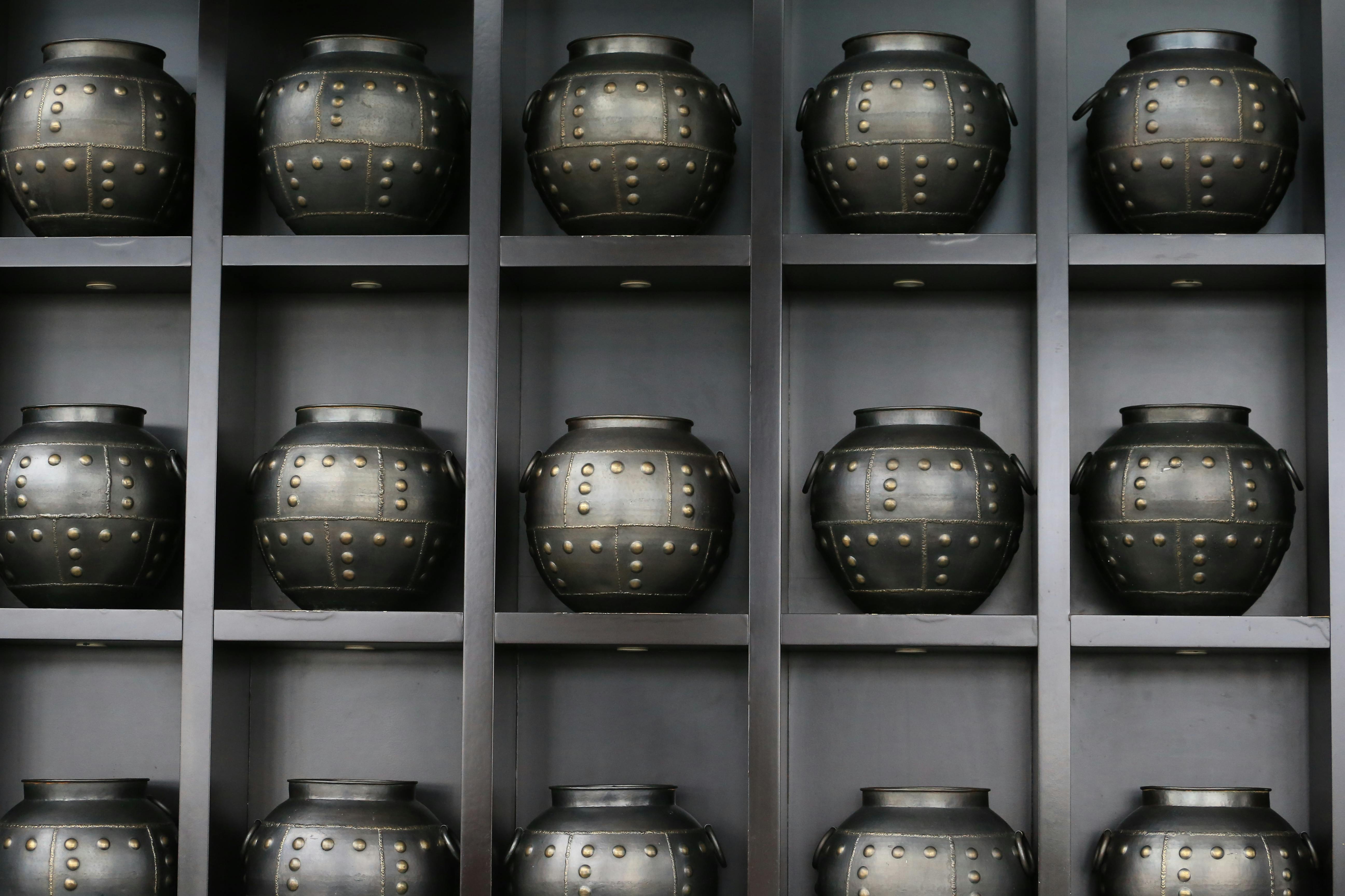 Iron Containers on a Cabinet · Free Stock Photo