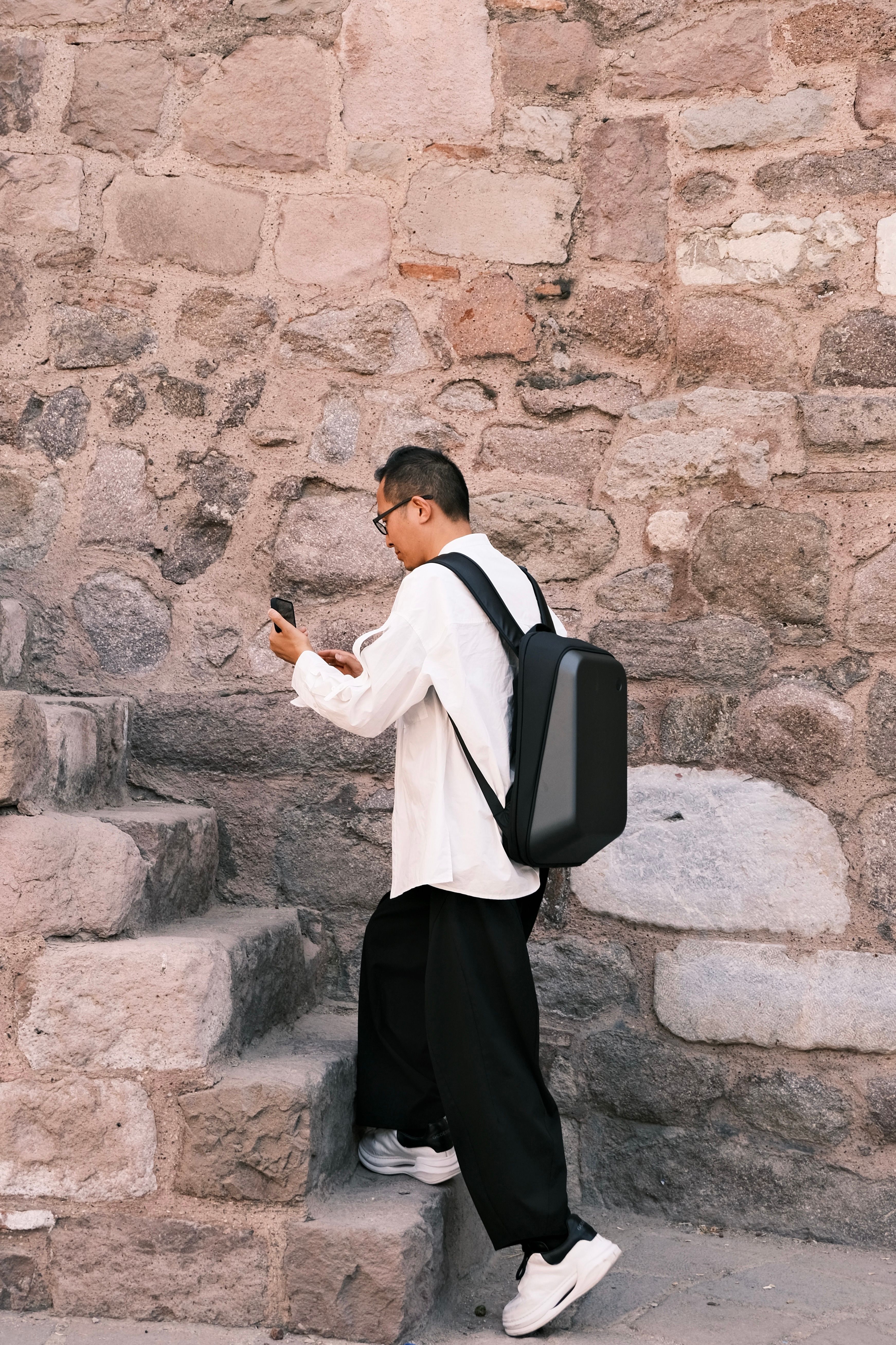 Man Walking on Stone Stairs · Free Stock Photo