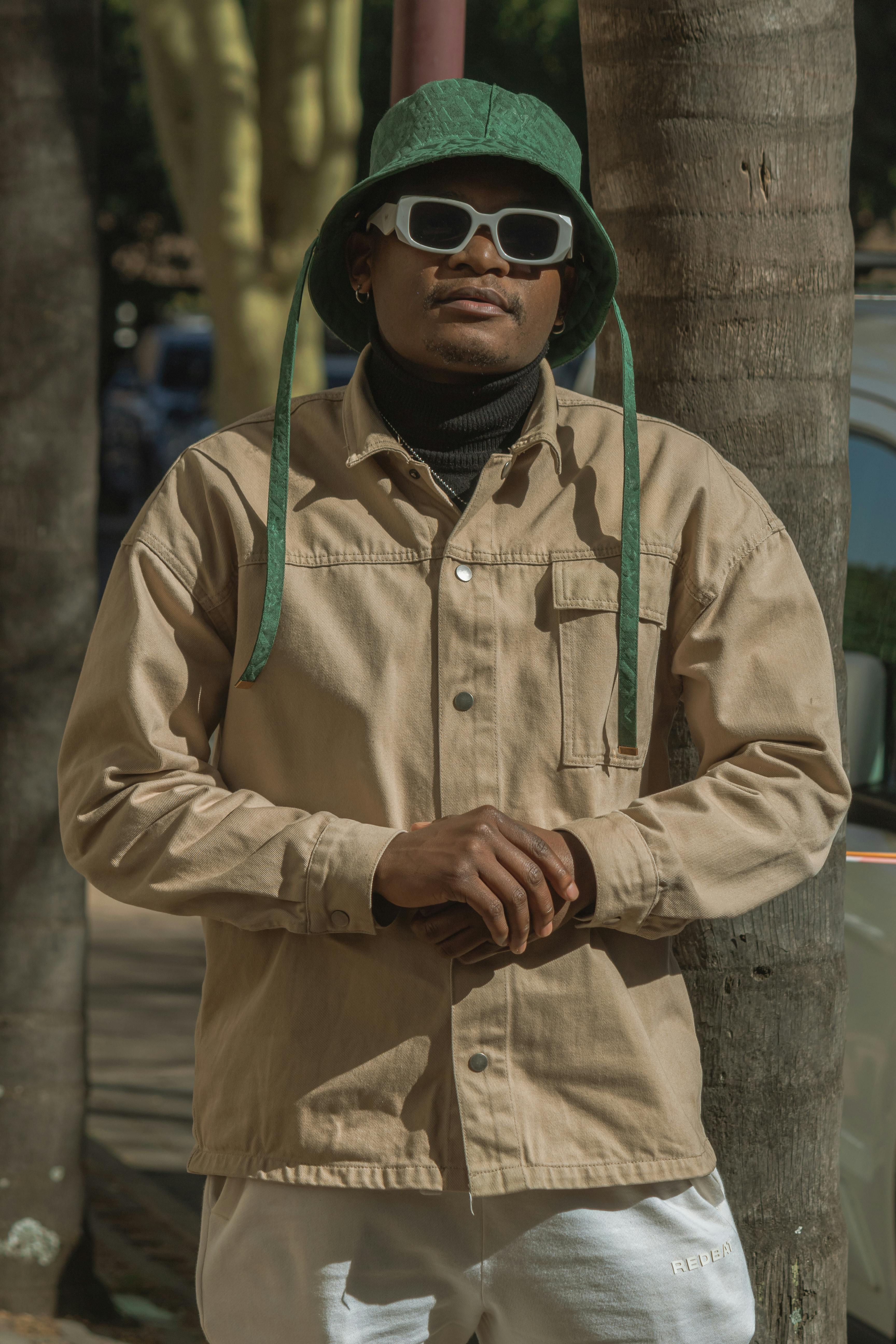 Man in Hat and Jacket on Field · Free Stock Photo