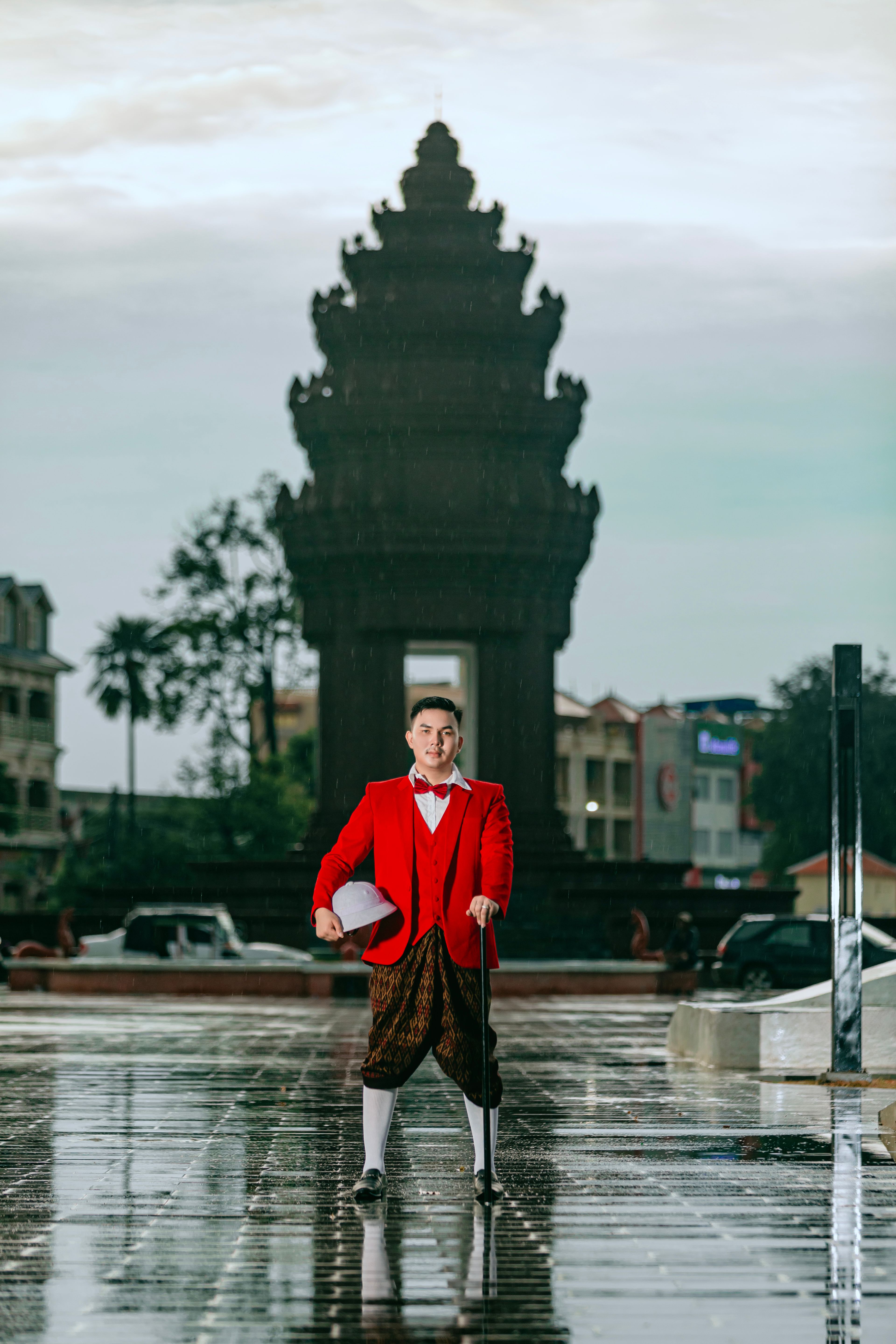 Man in Red Jacket Standing with Hat and Walking Stick · Free Stock Photo
