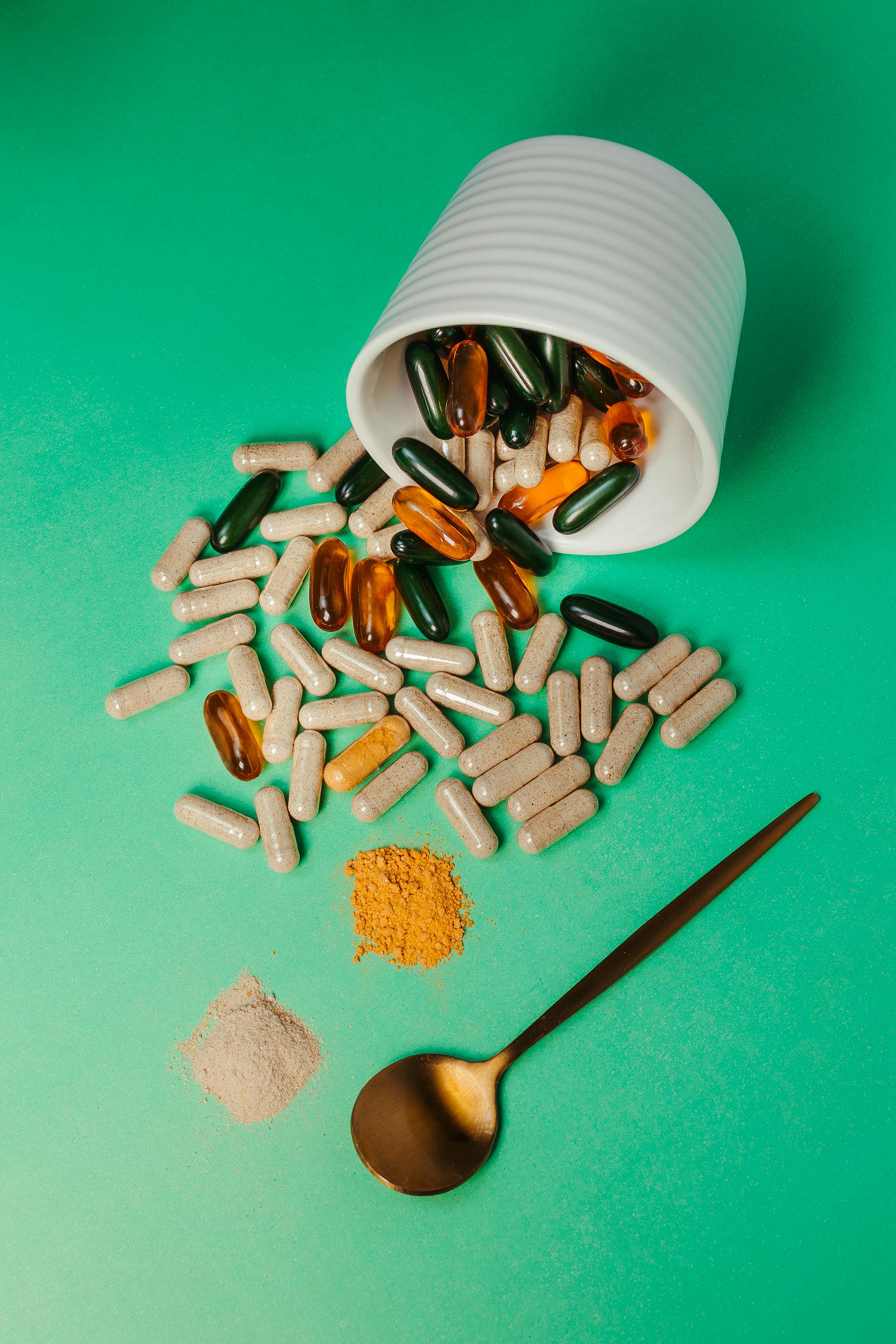 Multi Colored Capsules, Bowl and Spoon · Free Stock Photo