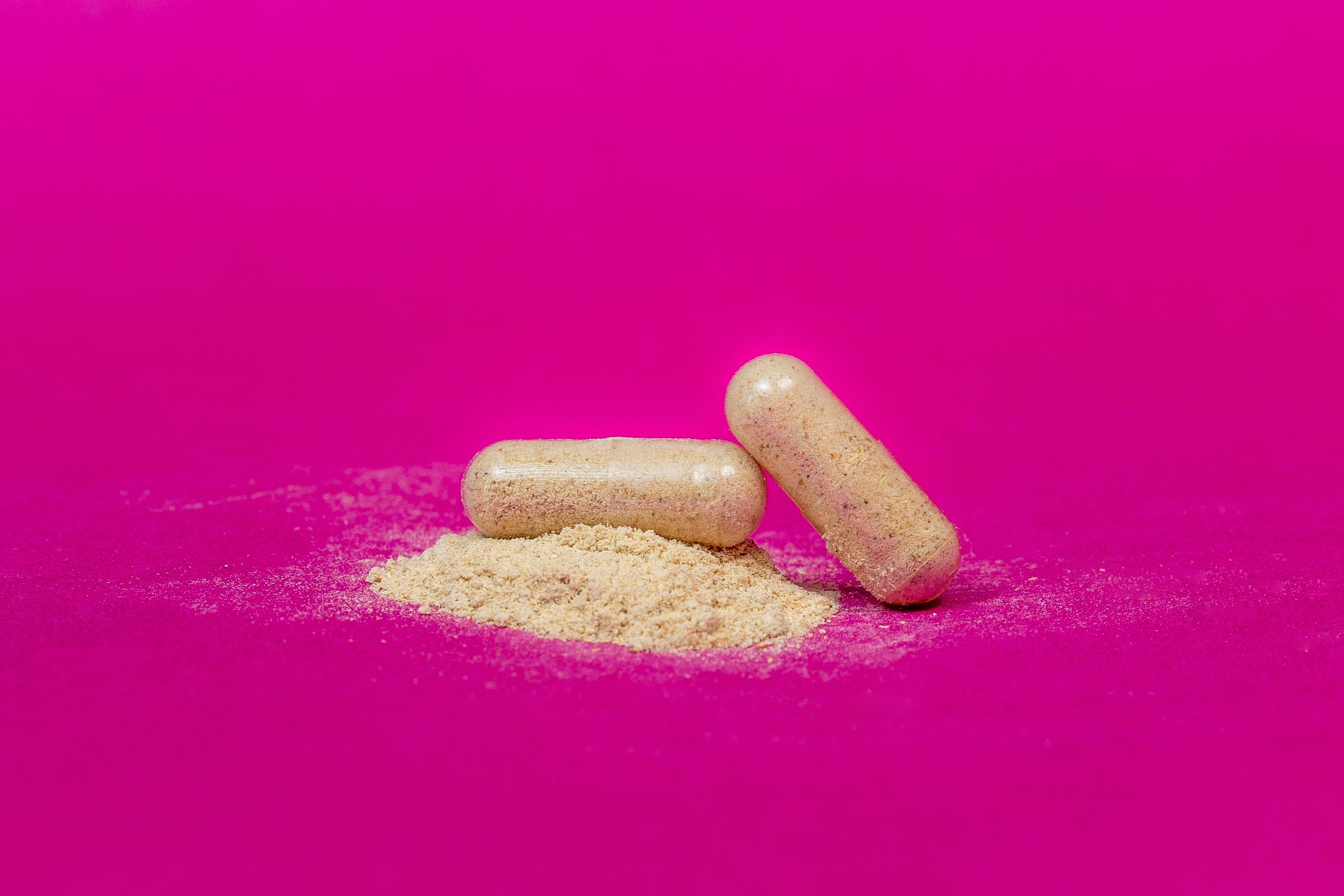 Two Capsule Pills with Powder · Free Stock Photo