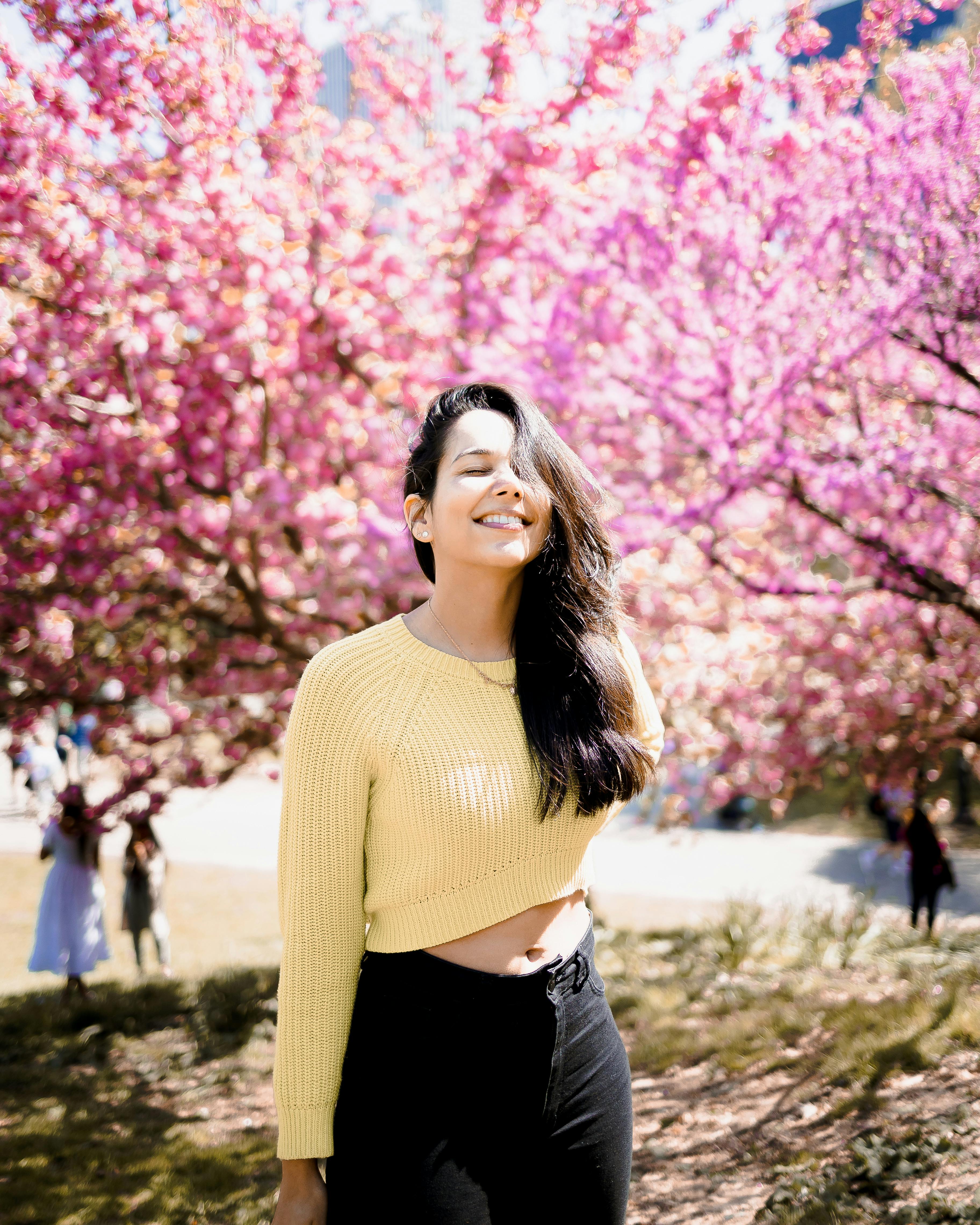 Smiling Woman with Trees in Spring behind · Free Stock Photo