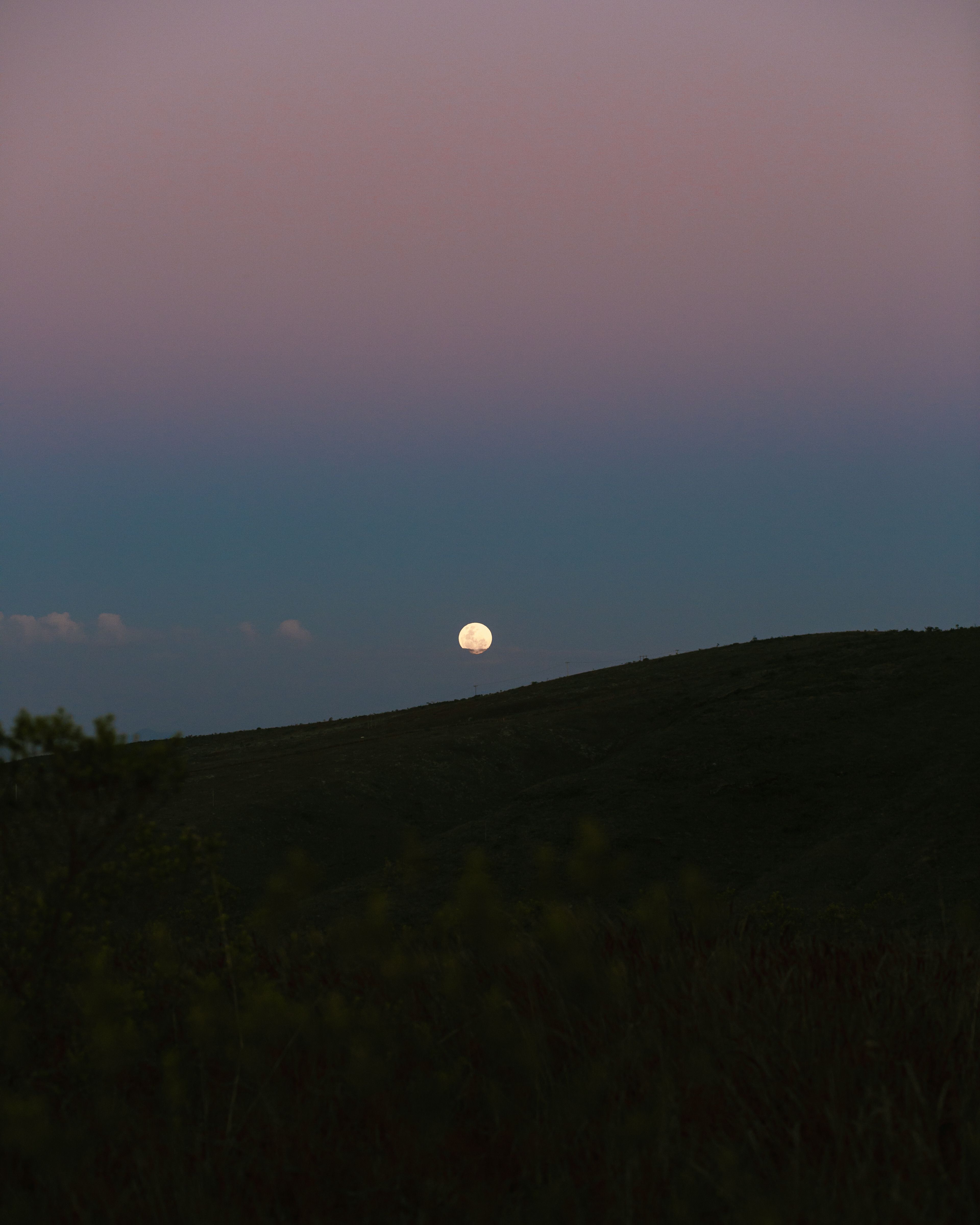 Moon Rising over a Hill at Dusk · Free Stock Photo