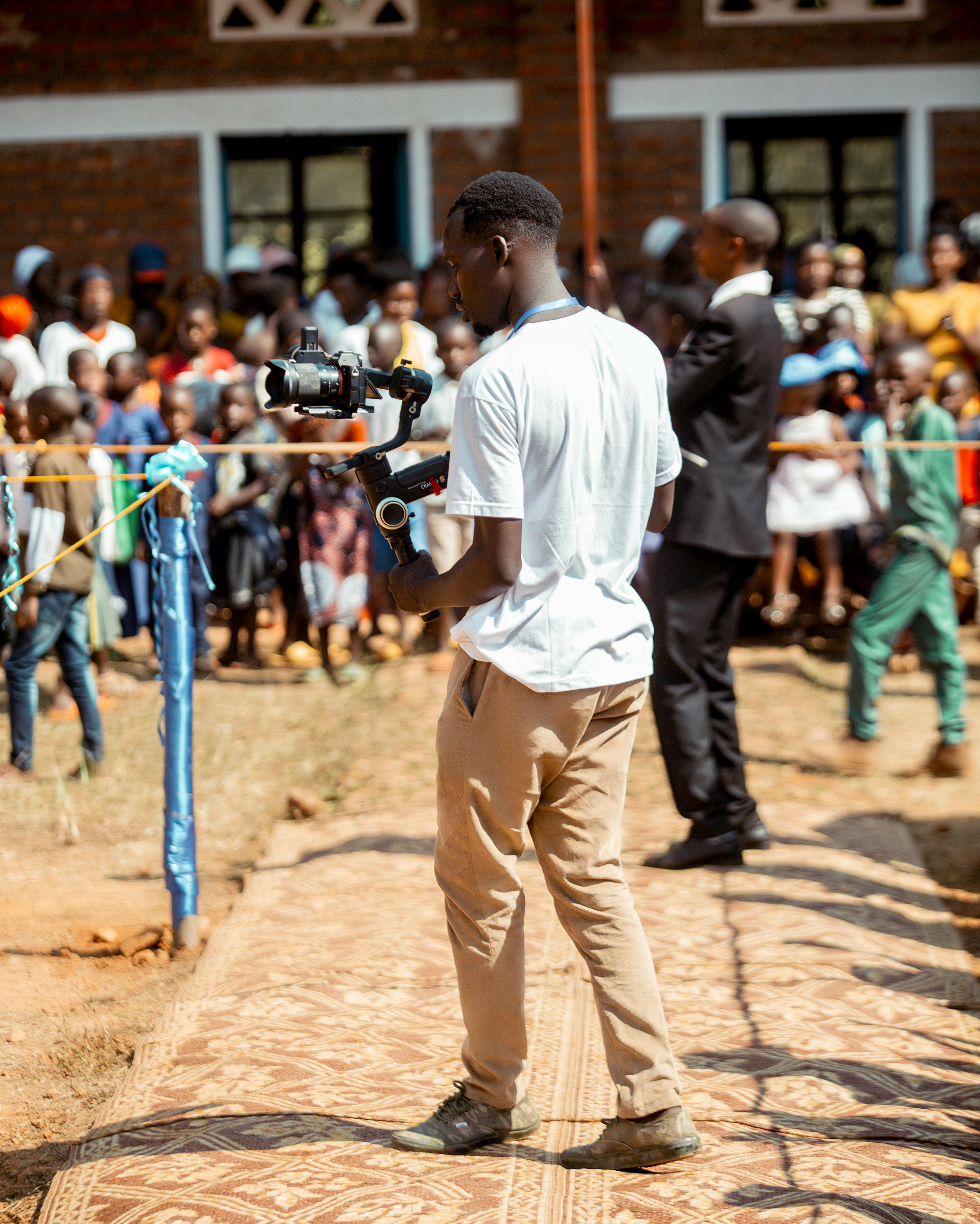 2 Camera Man Standing in a Green Metal Stage during Daytime · Free ...