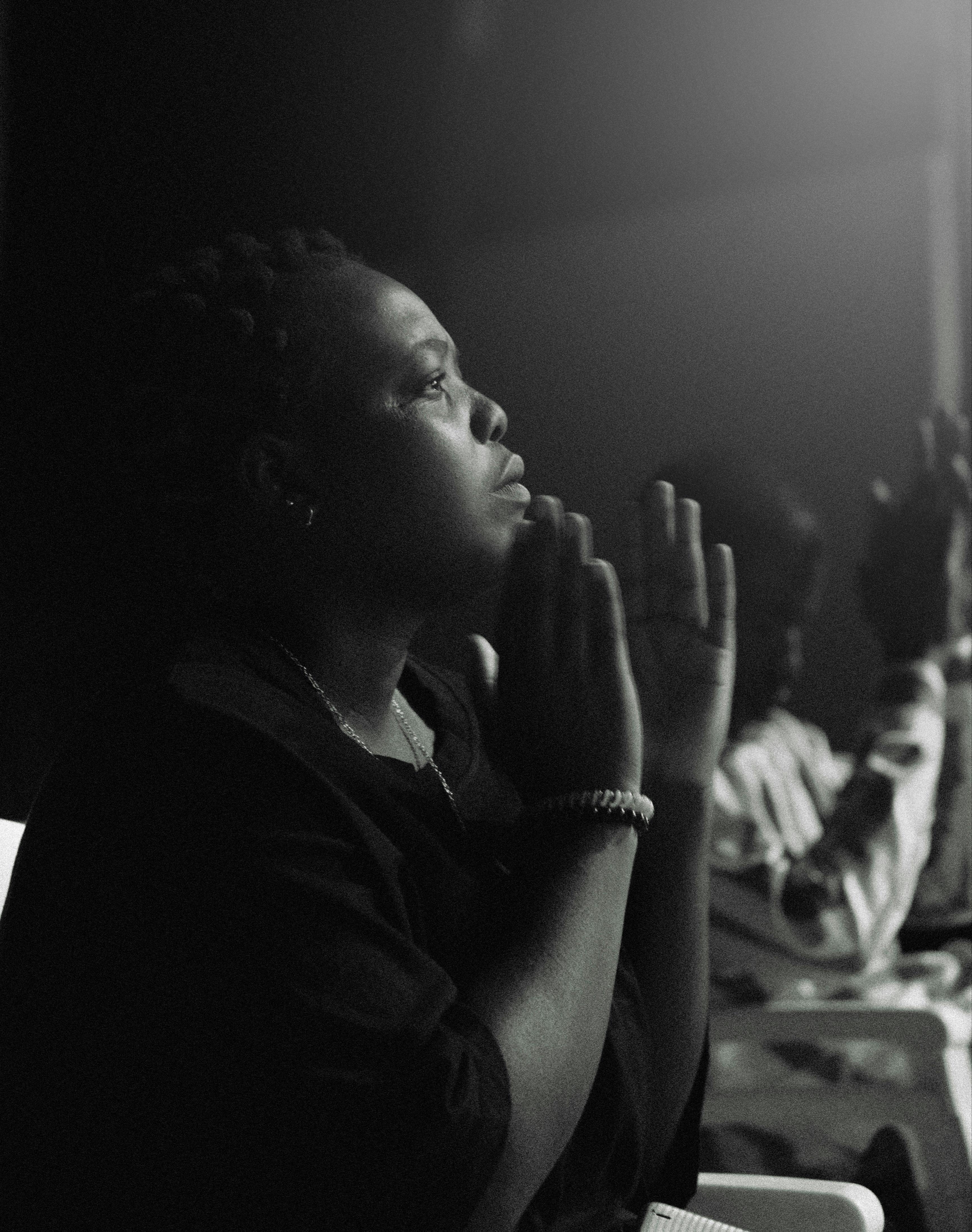 Portrait of a Man Praying in Black and White · Free Stock Photo