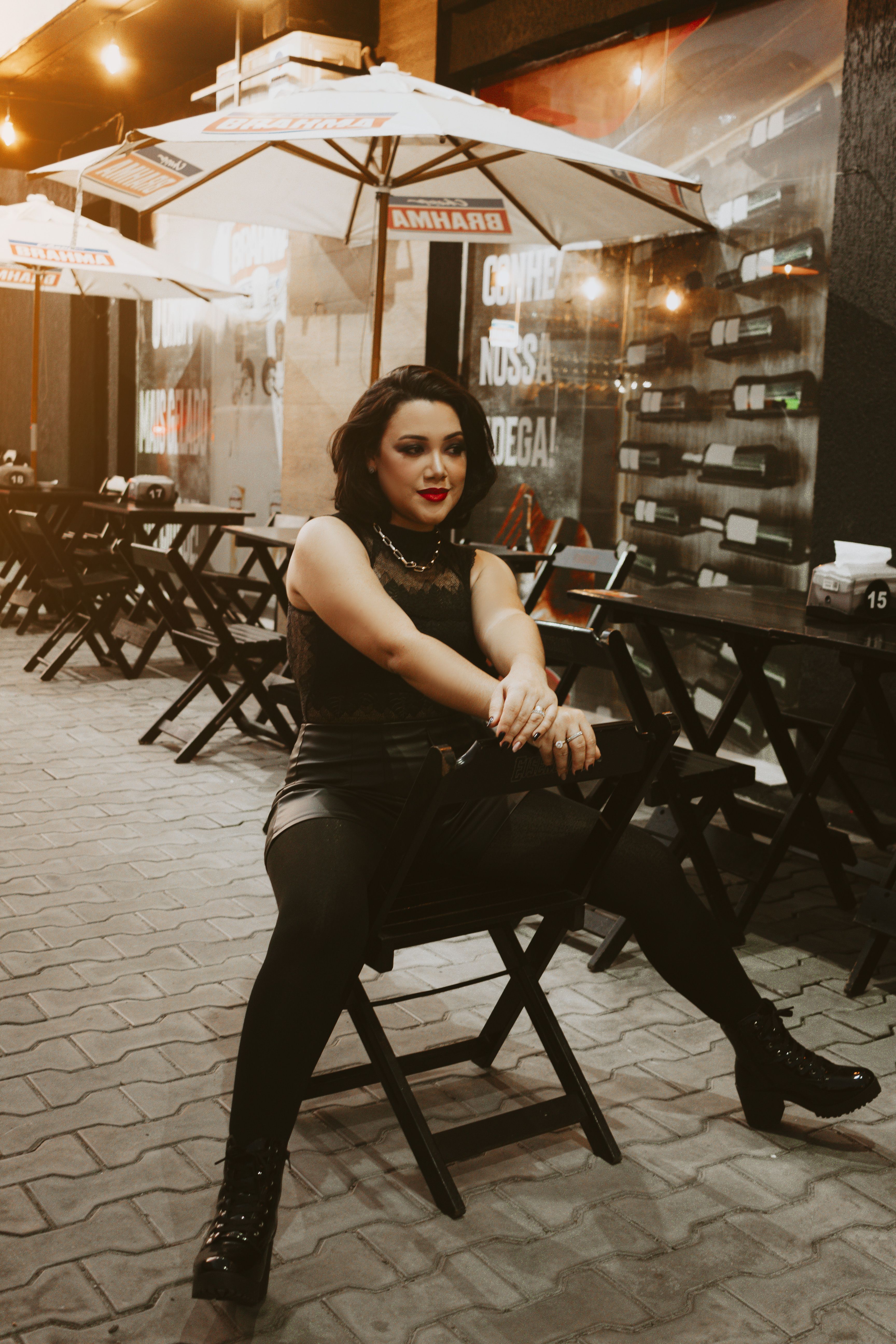 Portrait of a Female Model Sitting in a Bar · Free Stock Photo