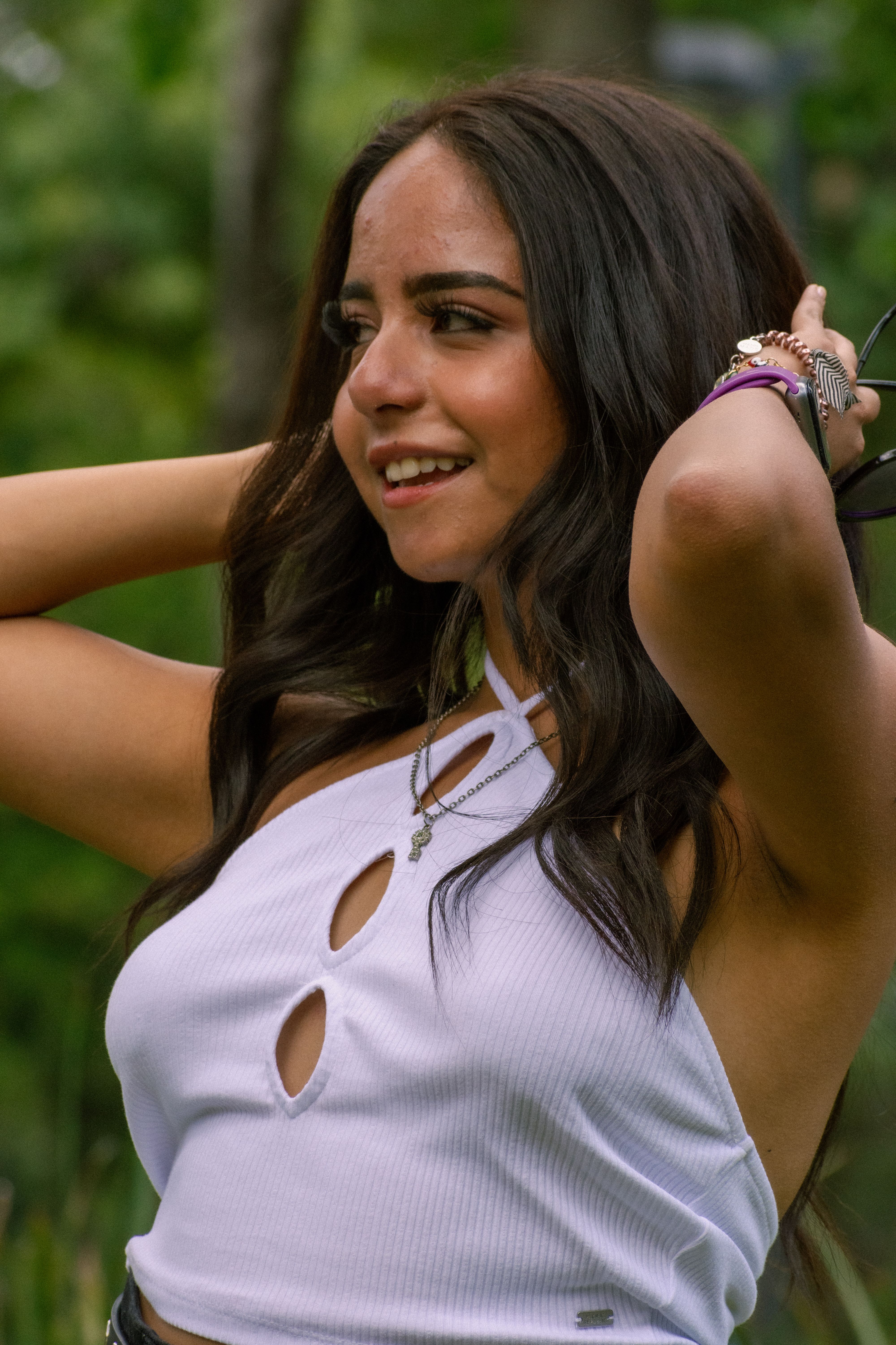 Woman in Halter Top Fixing Hair · Free Stock Photo