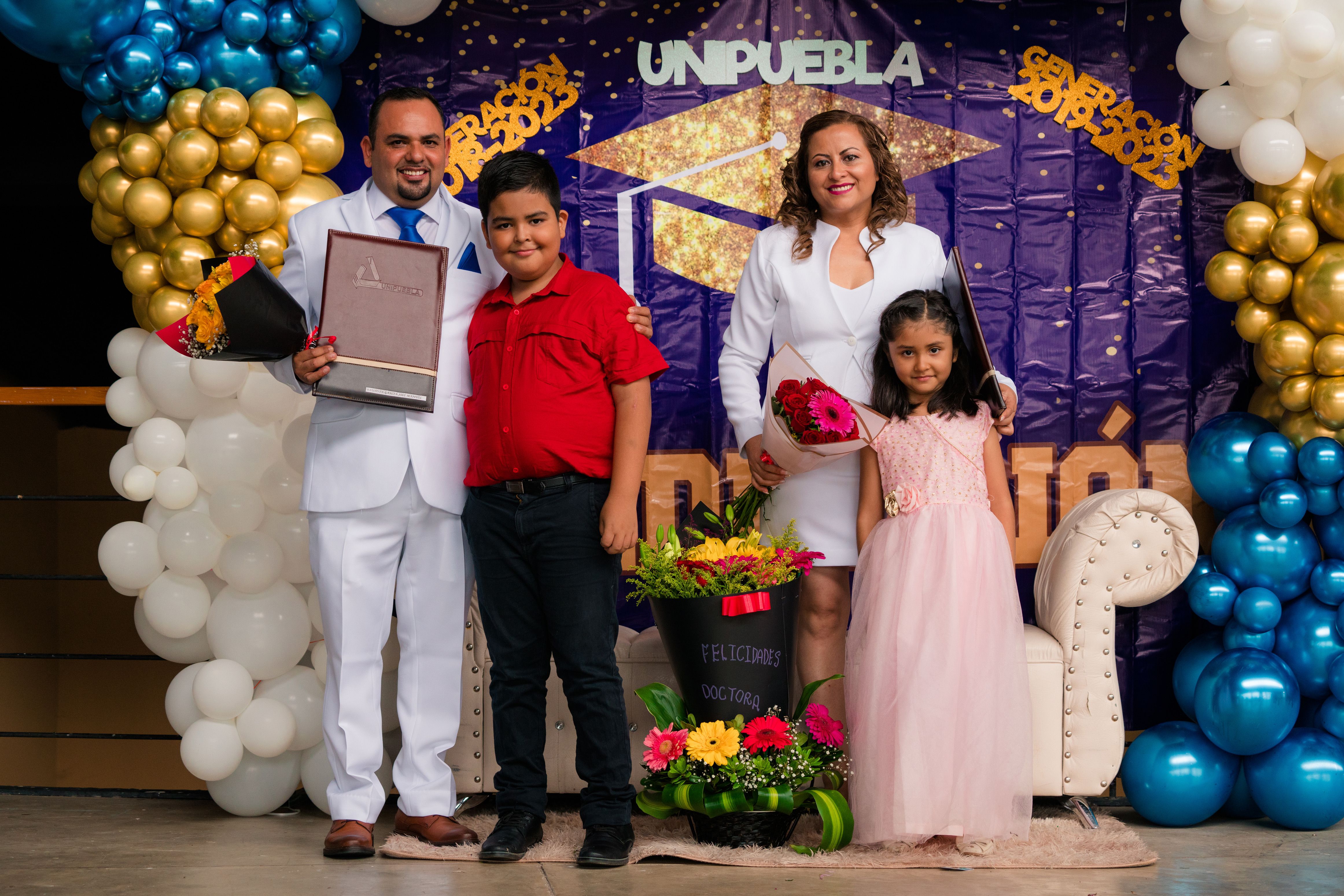 Family with Two Children Posing on a Stage at a School Celebration ...
