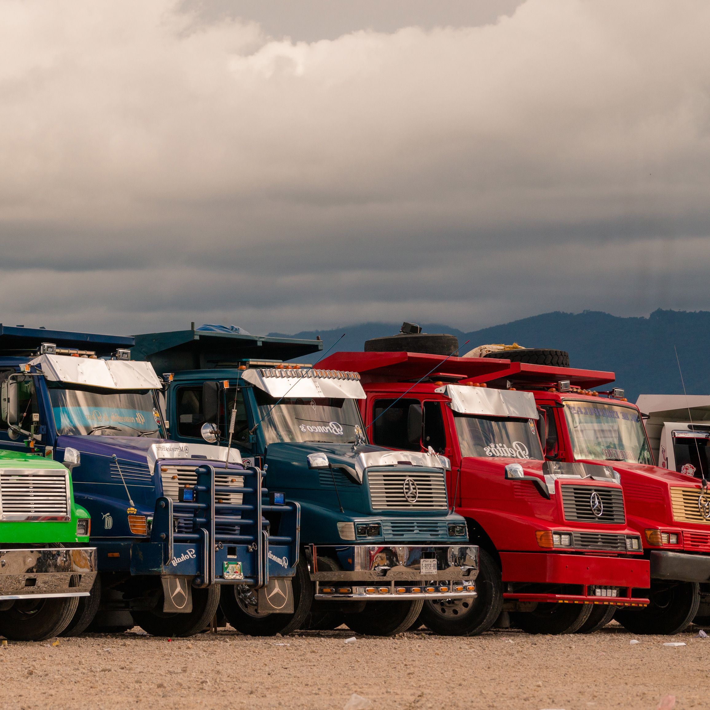 Photo of Trucks in a Row on a Car Park · Free Stock Photo