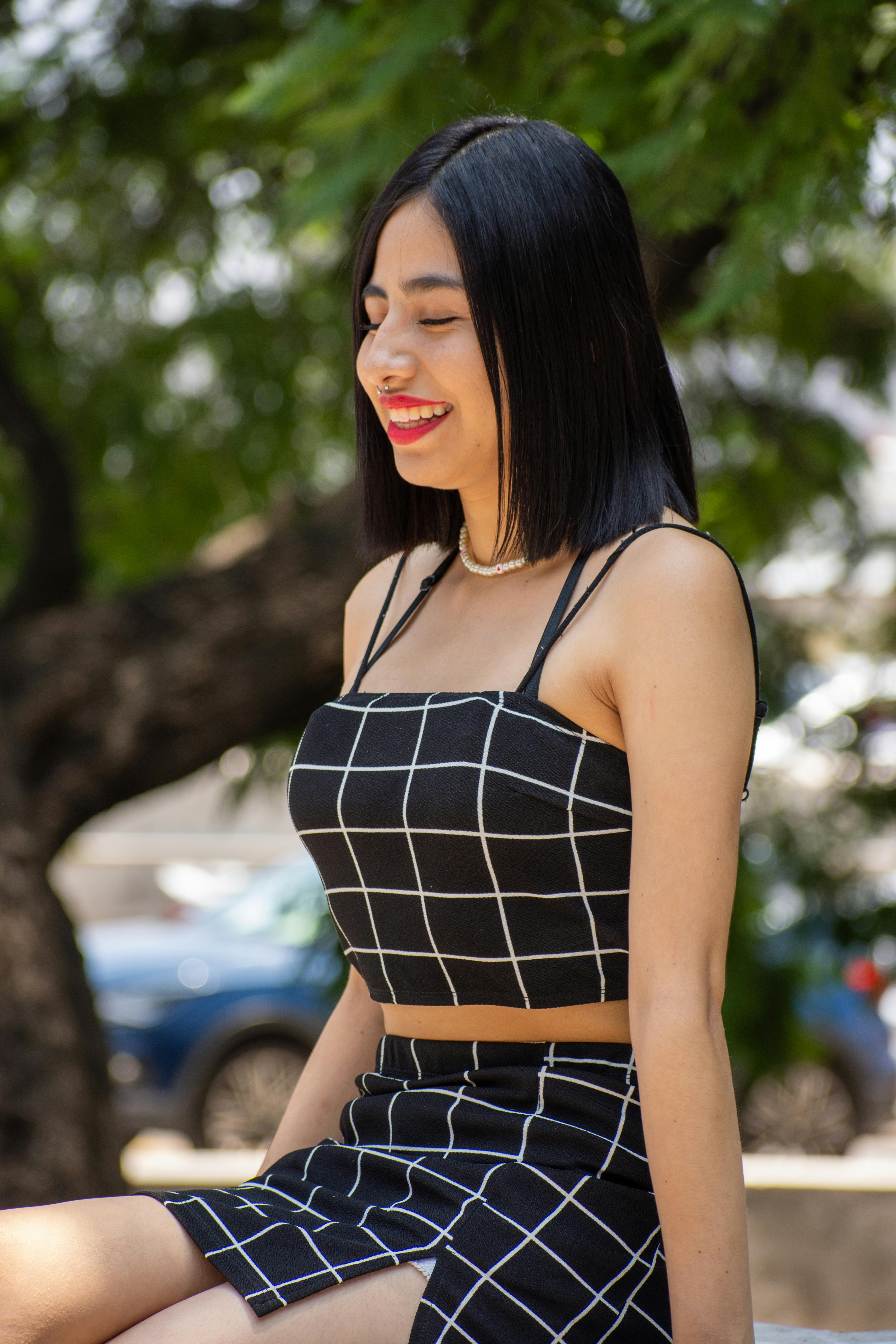 Brunette Woman in Check Blazer and Skirt in Studio · Free Stock Photo