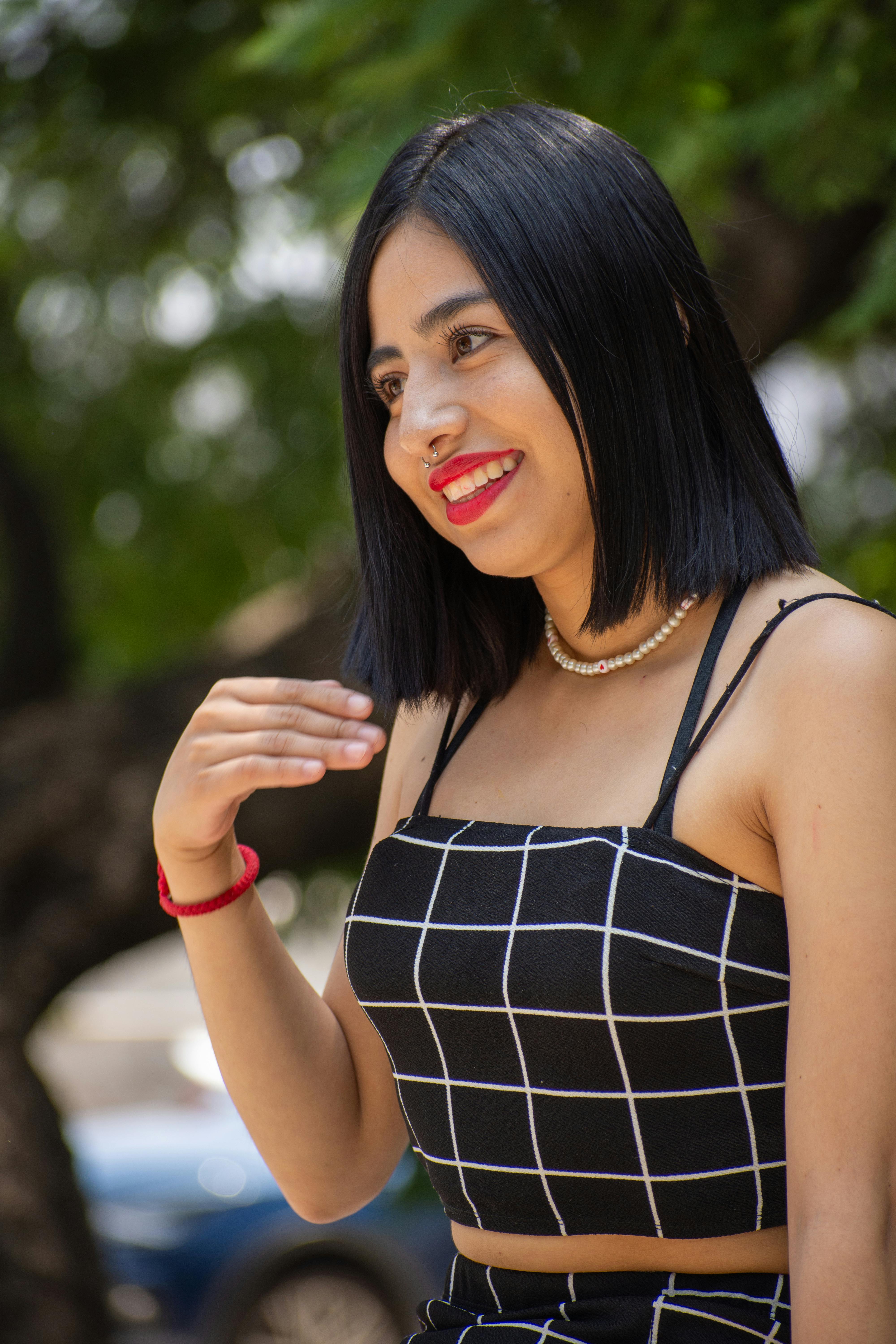 Woman in Checked Noodle Strap Top · Free Stock Photo