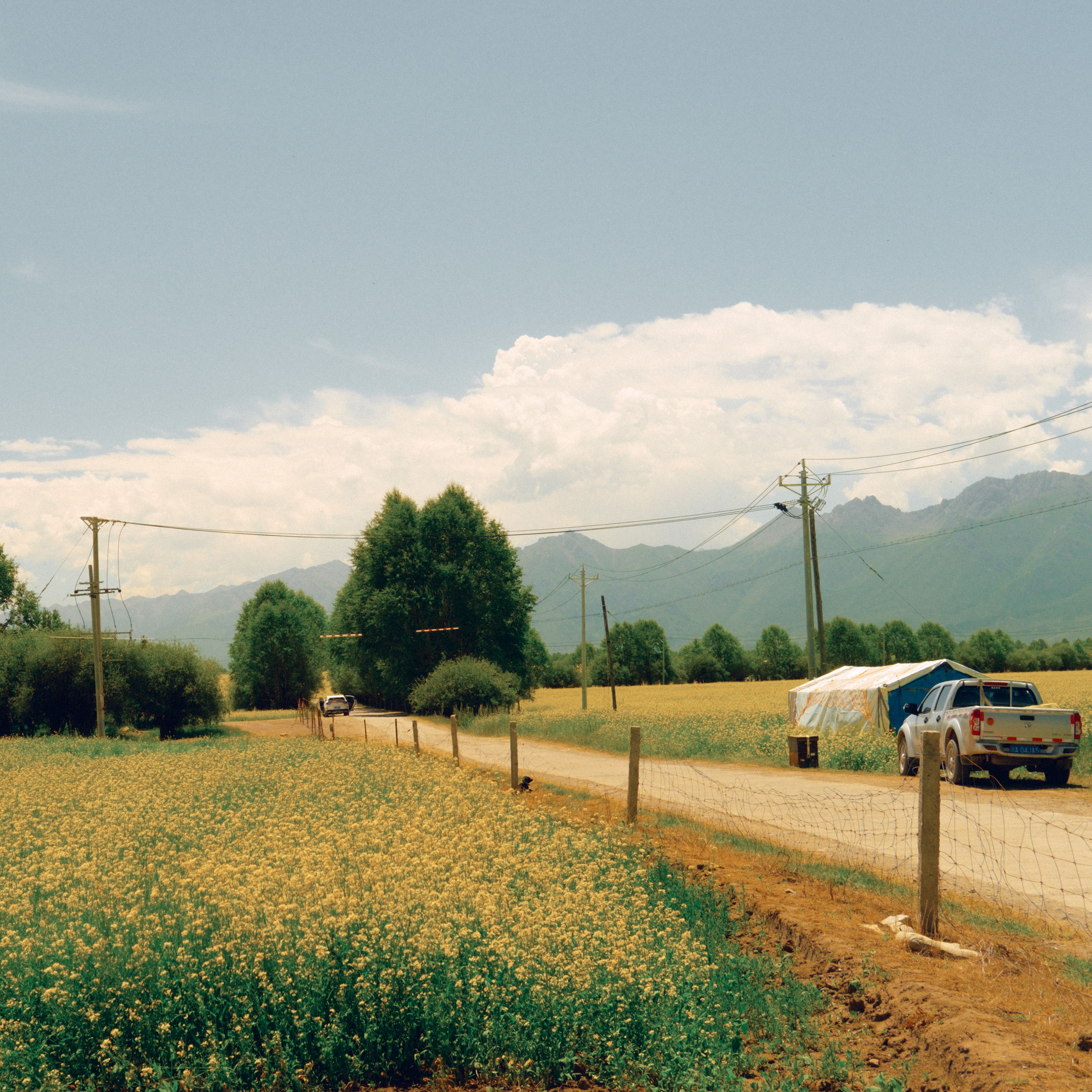 Cars on a Rural Road in Mountains · Free Stock Photo