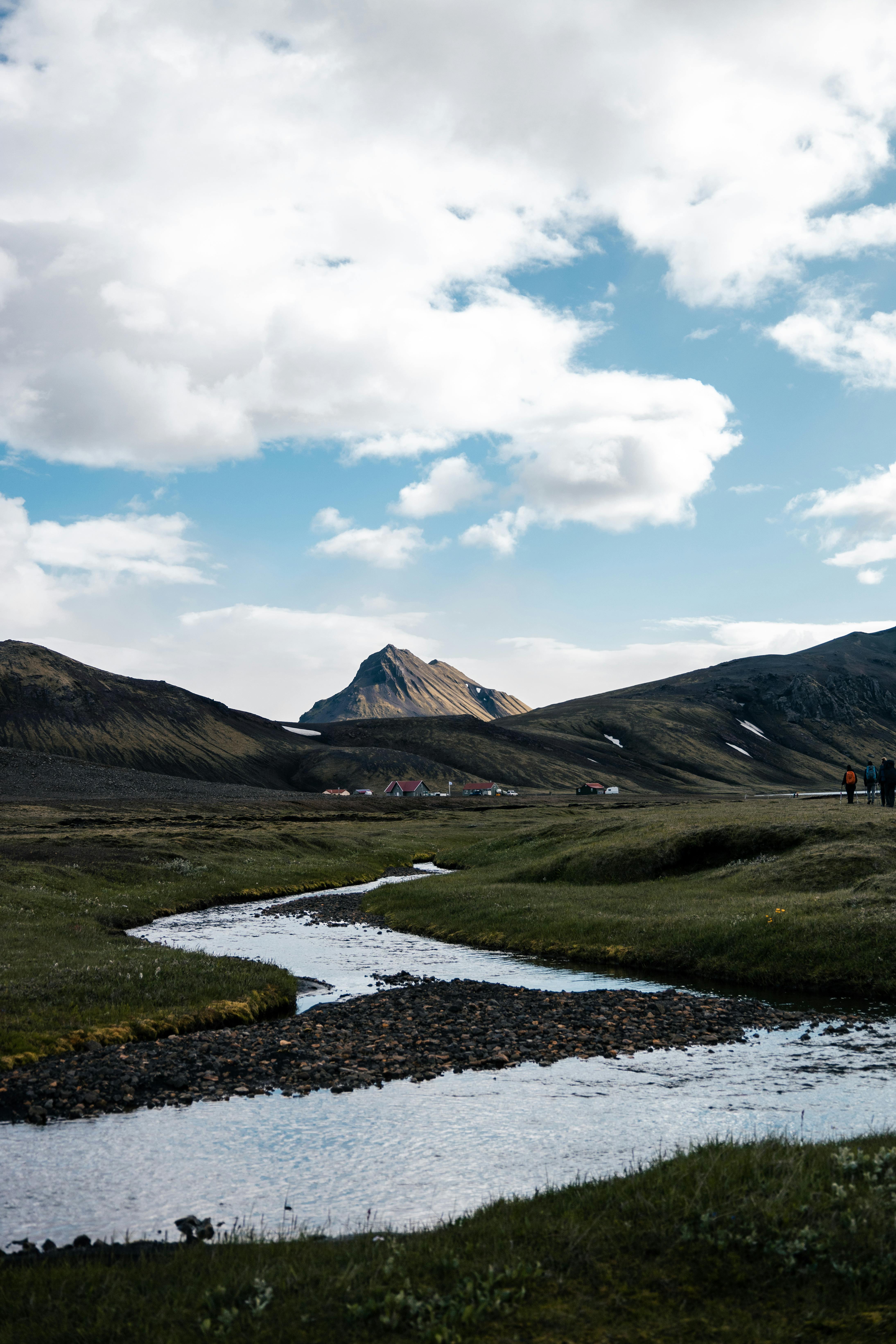 Landscape with a Mountain Peak, and Stream on a Field · Free Stock Photo