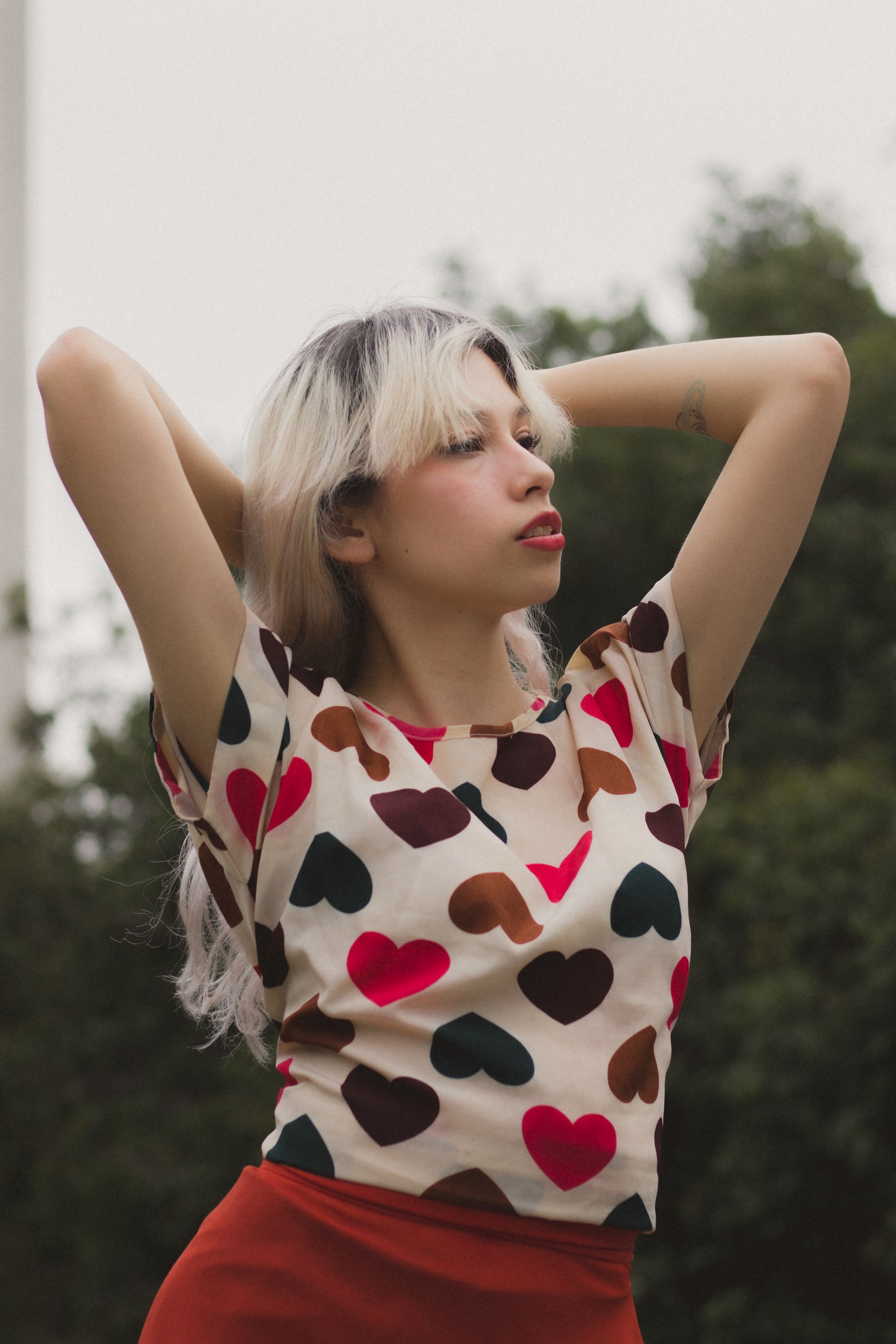 Young Woman with Dyed Hair Posing Outside · Free Stock Photo