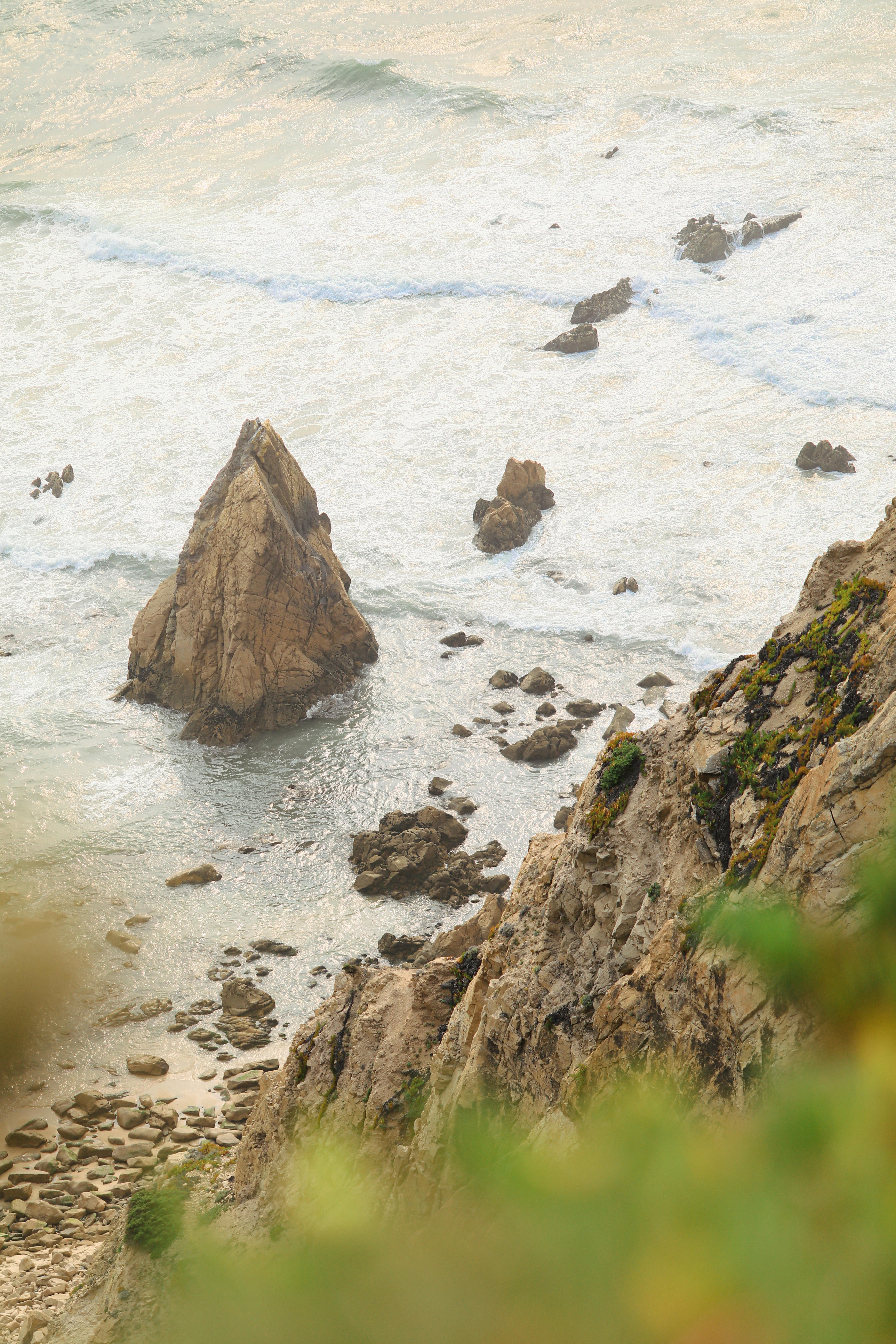Rocks on Shore near Ocean · Free Stock Photo