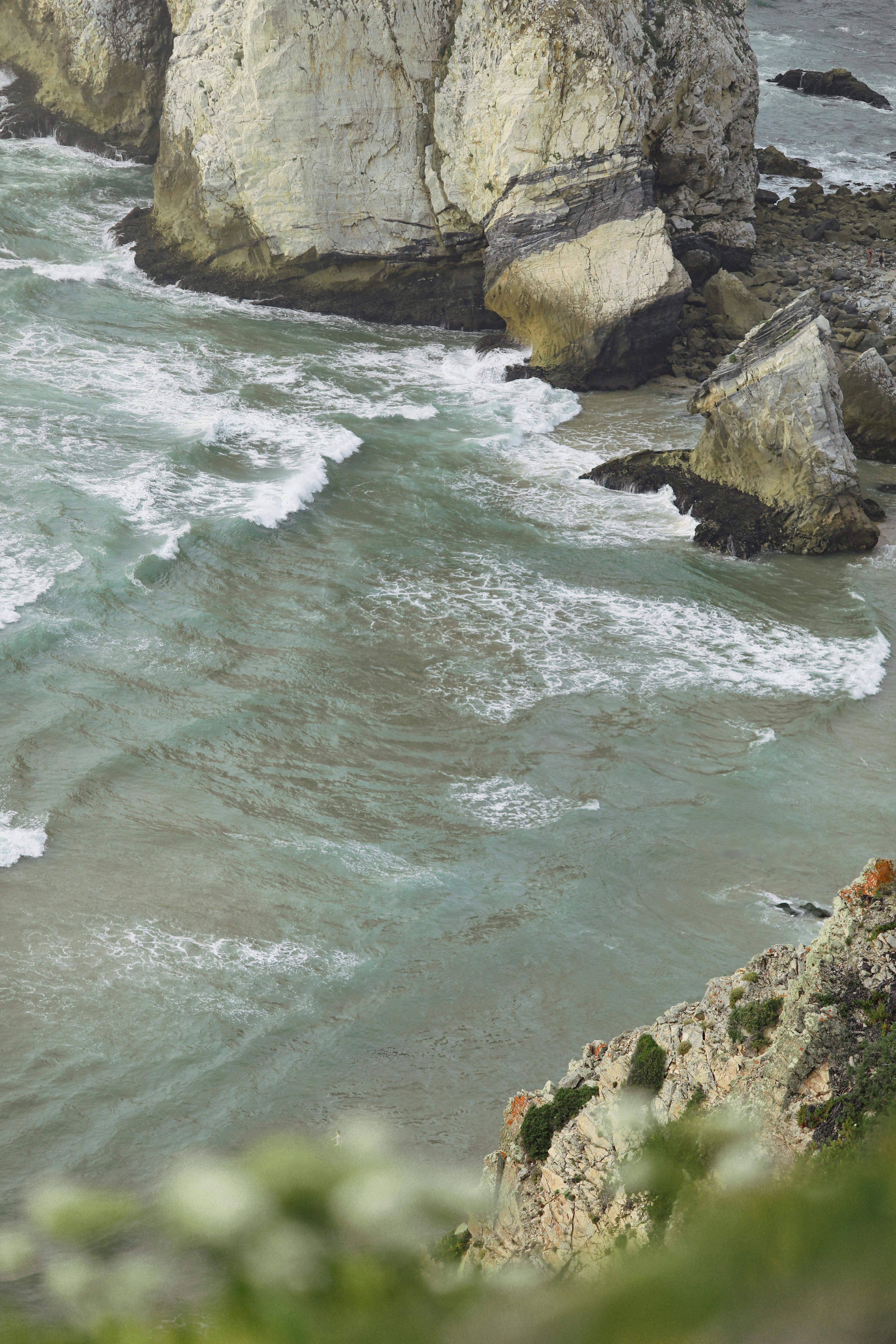 Rocks on Sea Shore at Ursa Beach · Free Stock Photo