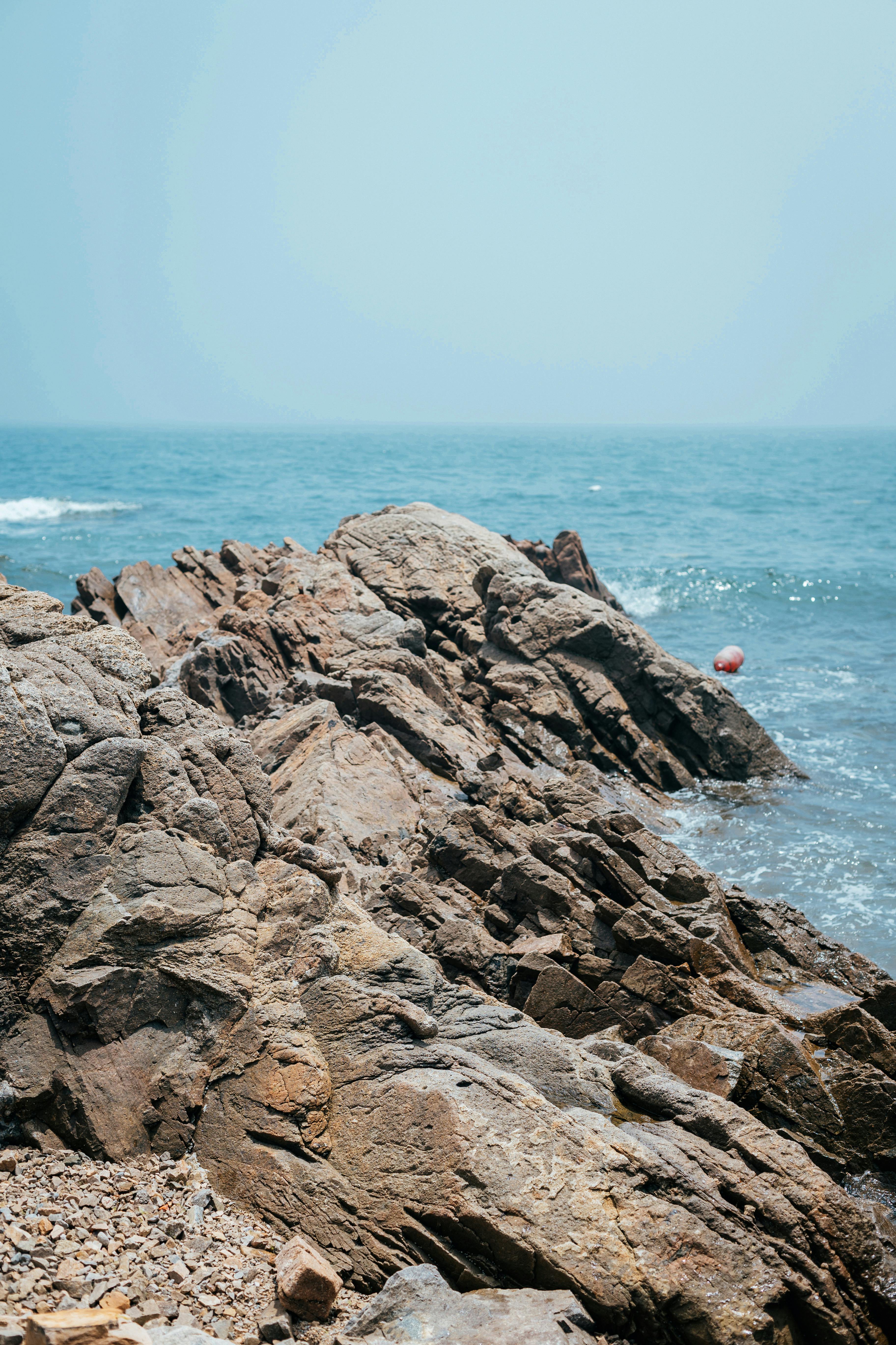 Rocky Peninsula and Buoy · Free Stock Photo