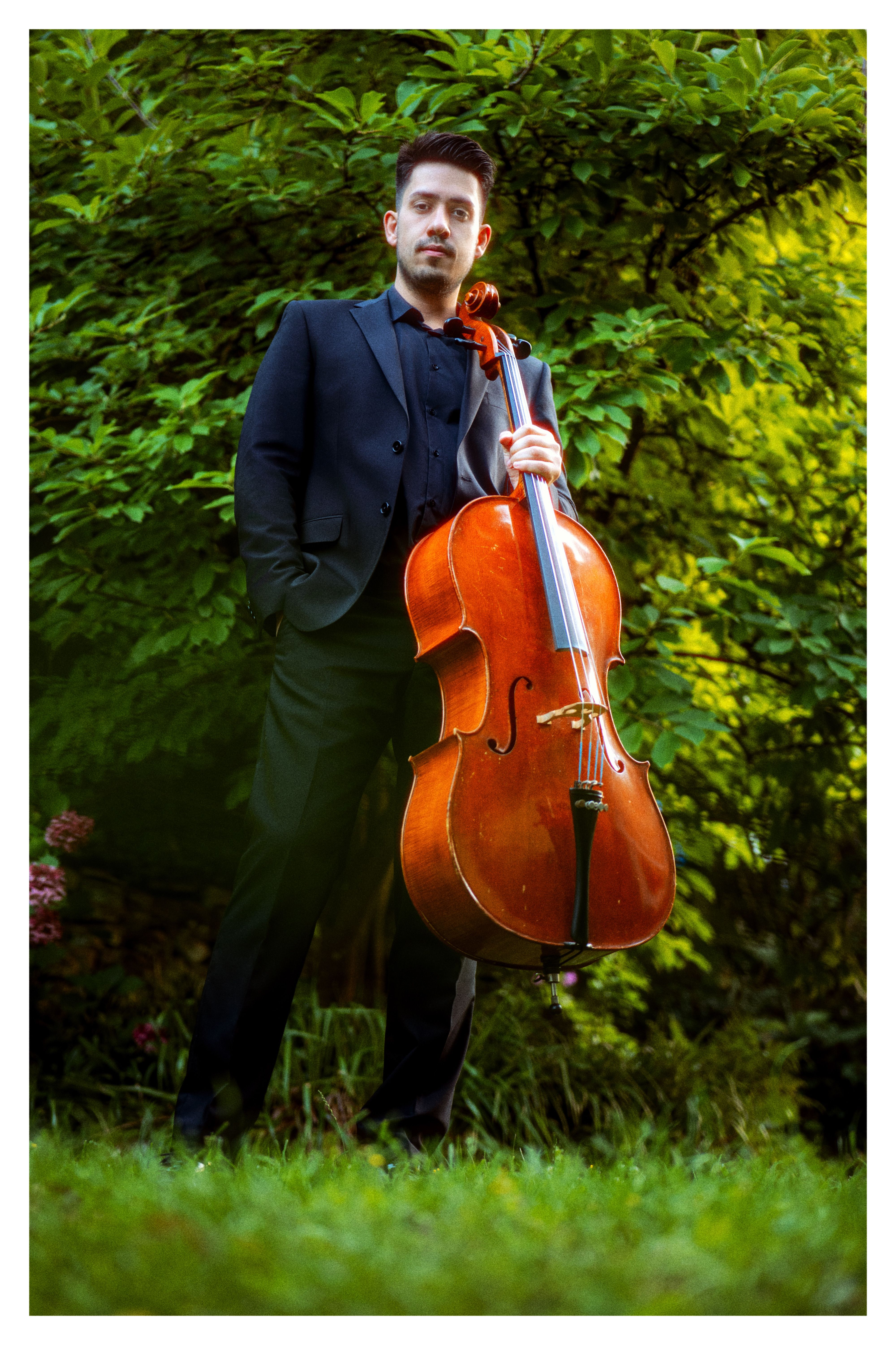 Elegant Musician with Cello in Hand · Free Stock Photo