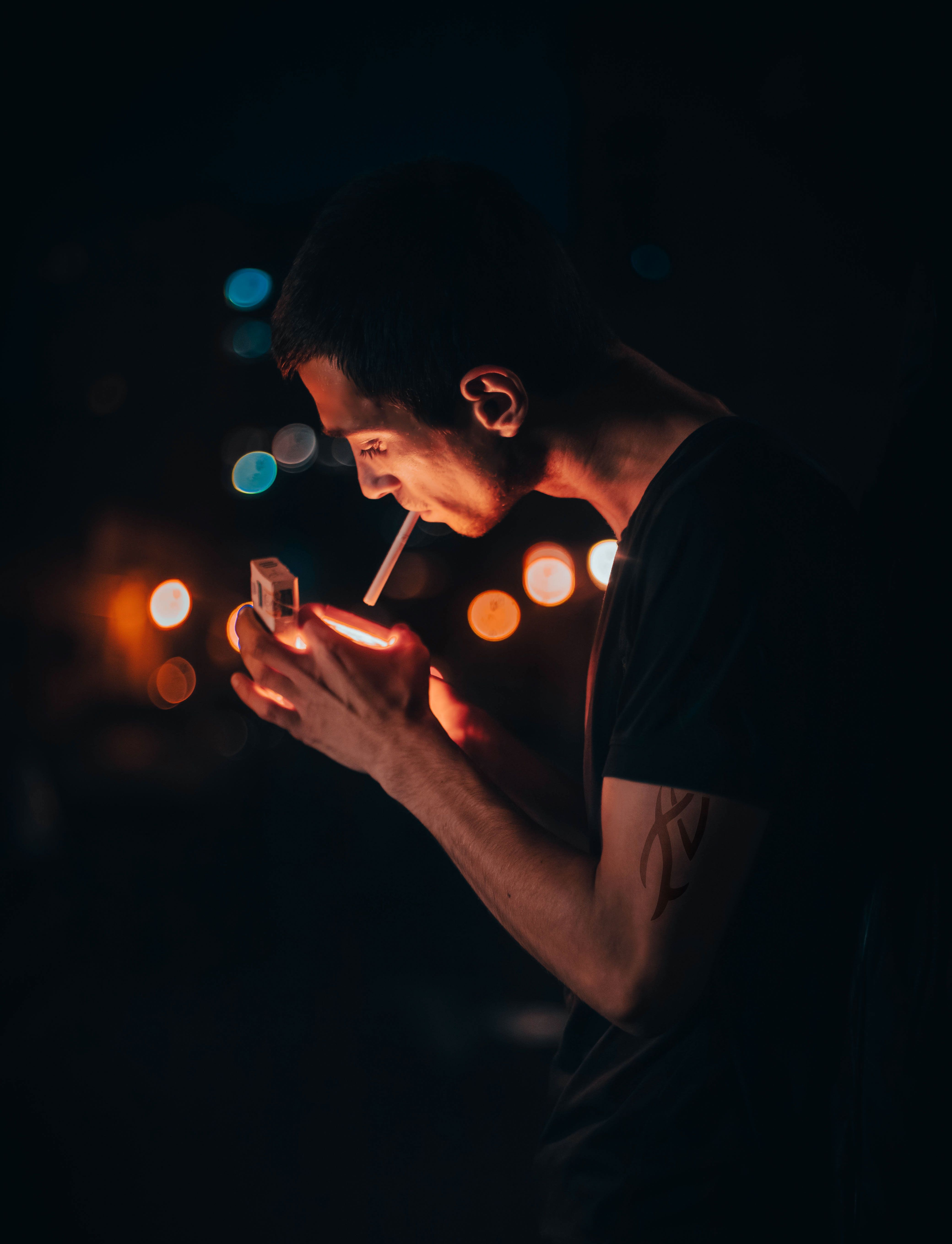 Man Lighting Cigarette at Night · Free Stock Photo