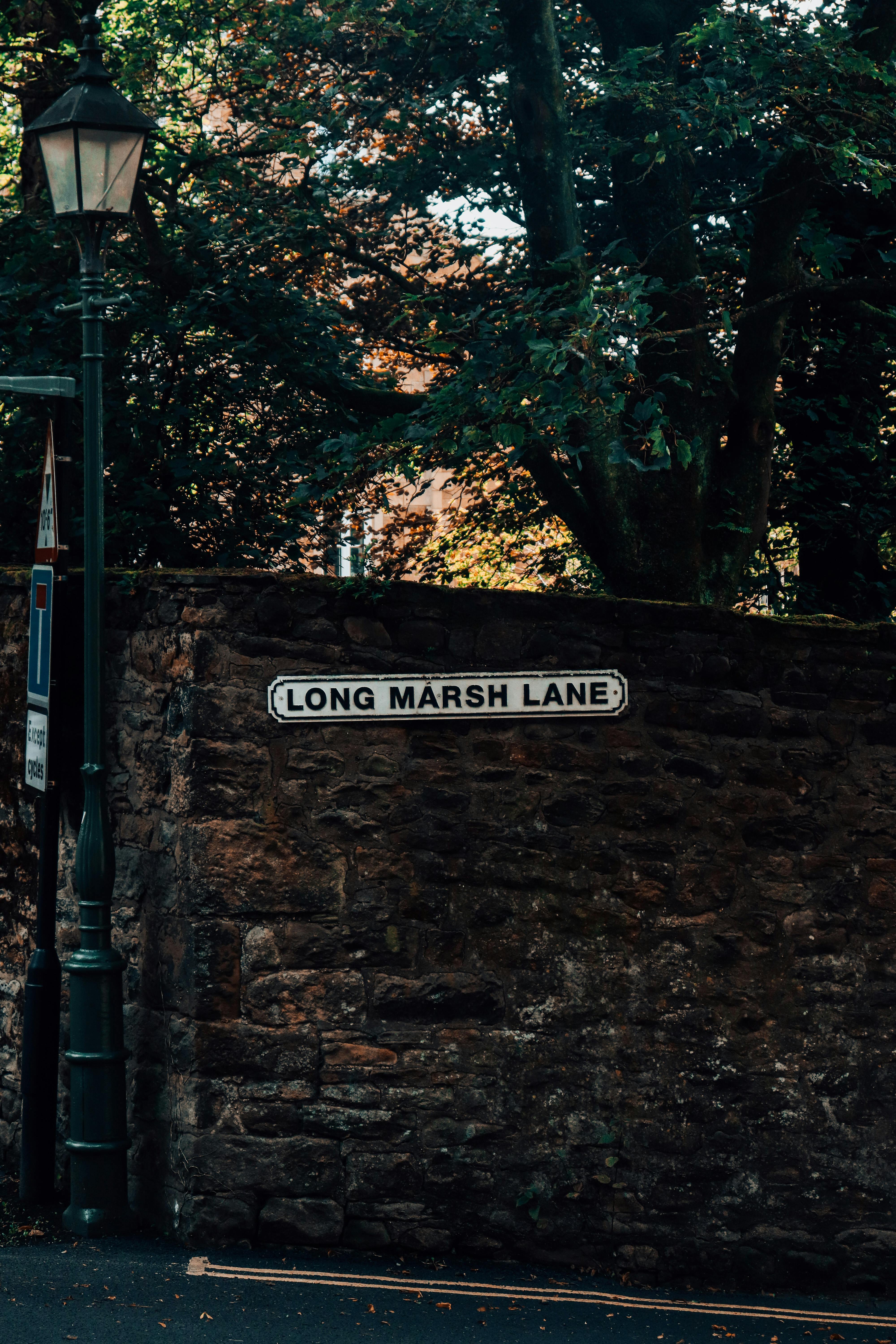 Long Marsh Lane Name on Stone Wall · Free Stock Photo