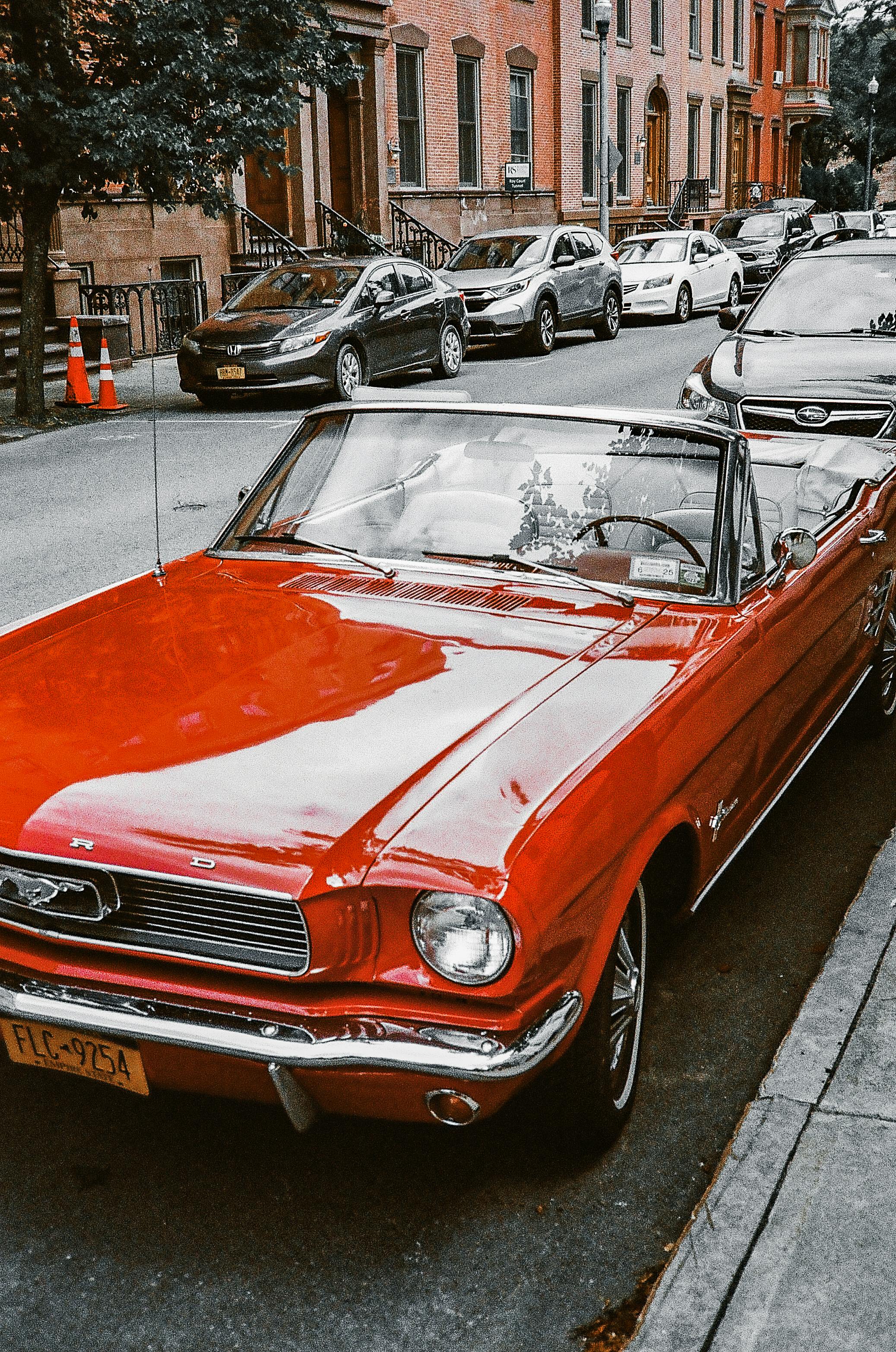 Retro Red Mustang Car on City Street · Free Stock Photo
