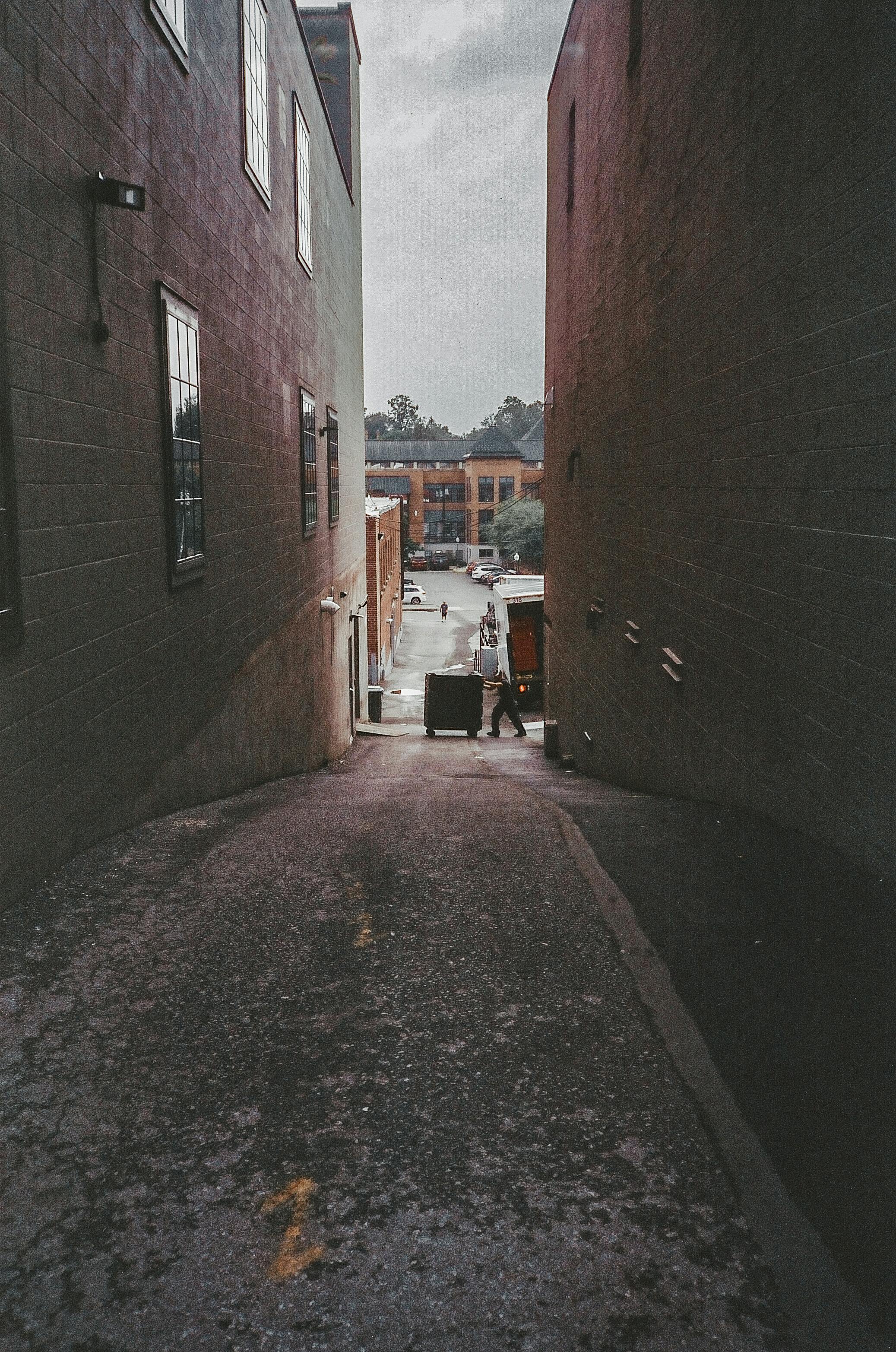 Narrow Alley Between Buildings in City · Free Stock Photo