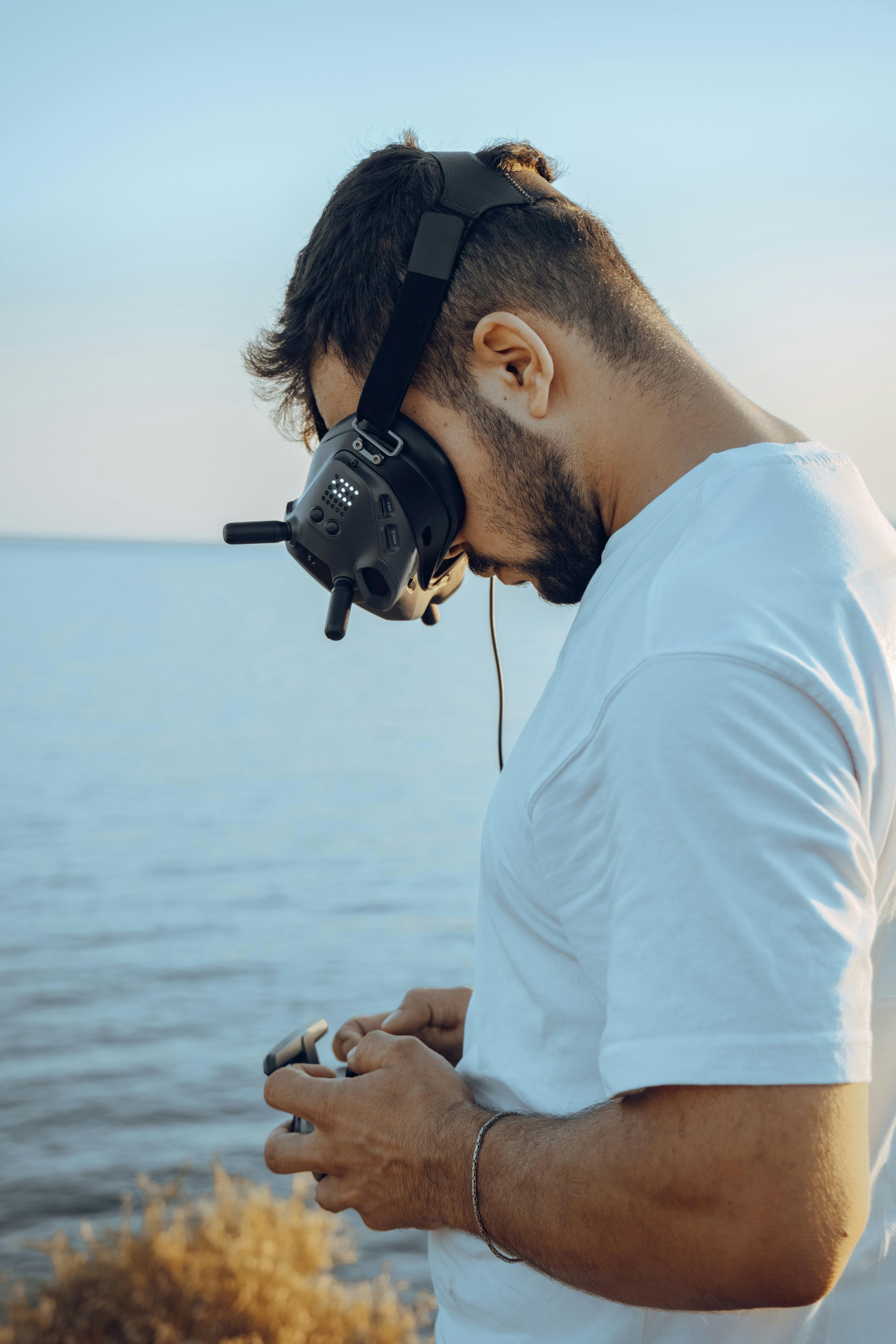 A Man Wearing Goggles and Controlling a Drone · Free Stock Photo