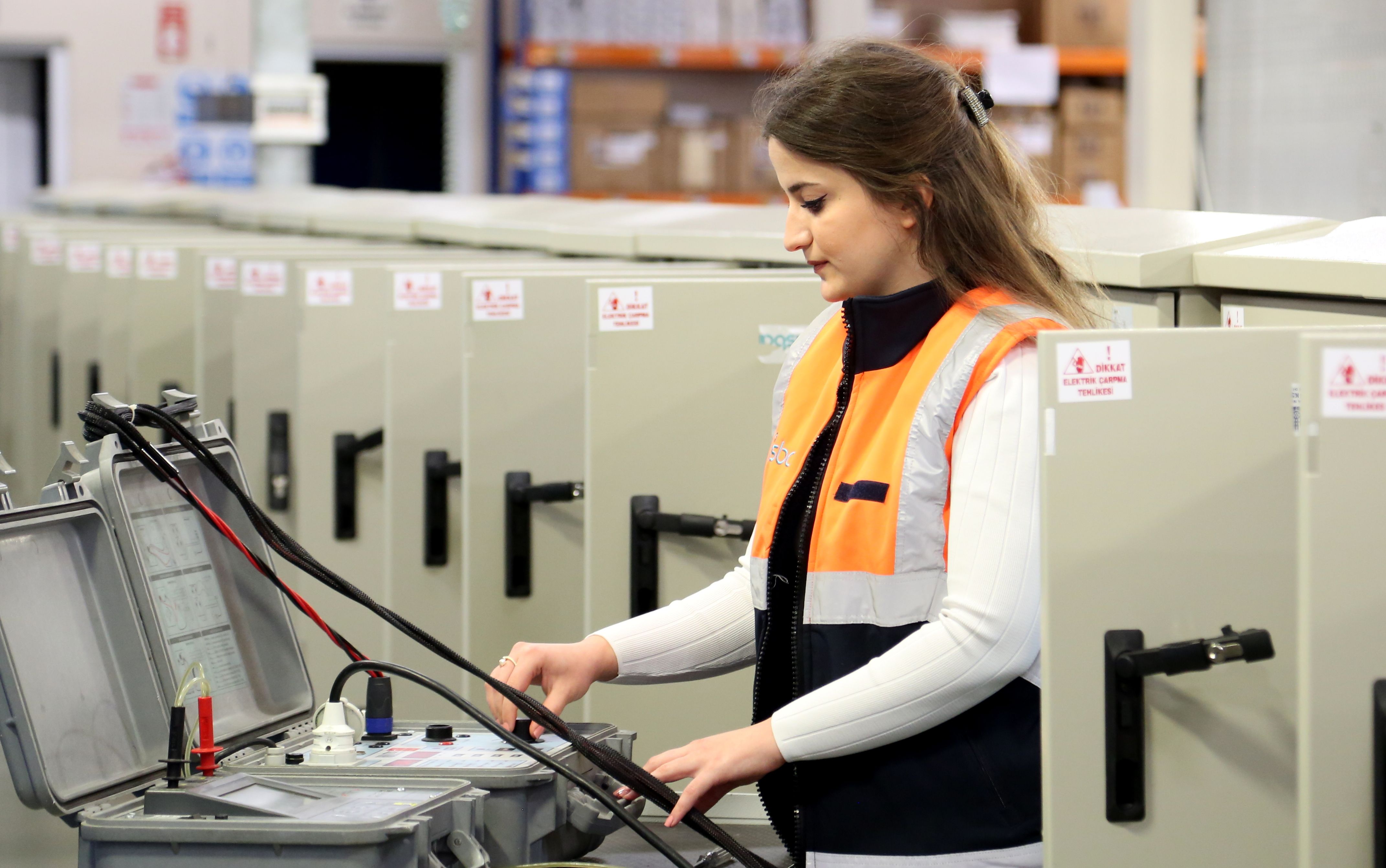 Woman Working with Electrical Equipment · Free Stock Photo