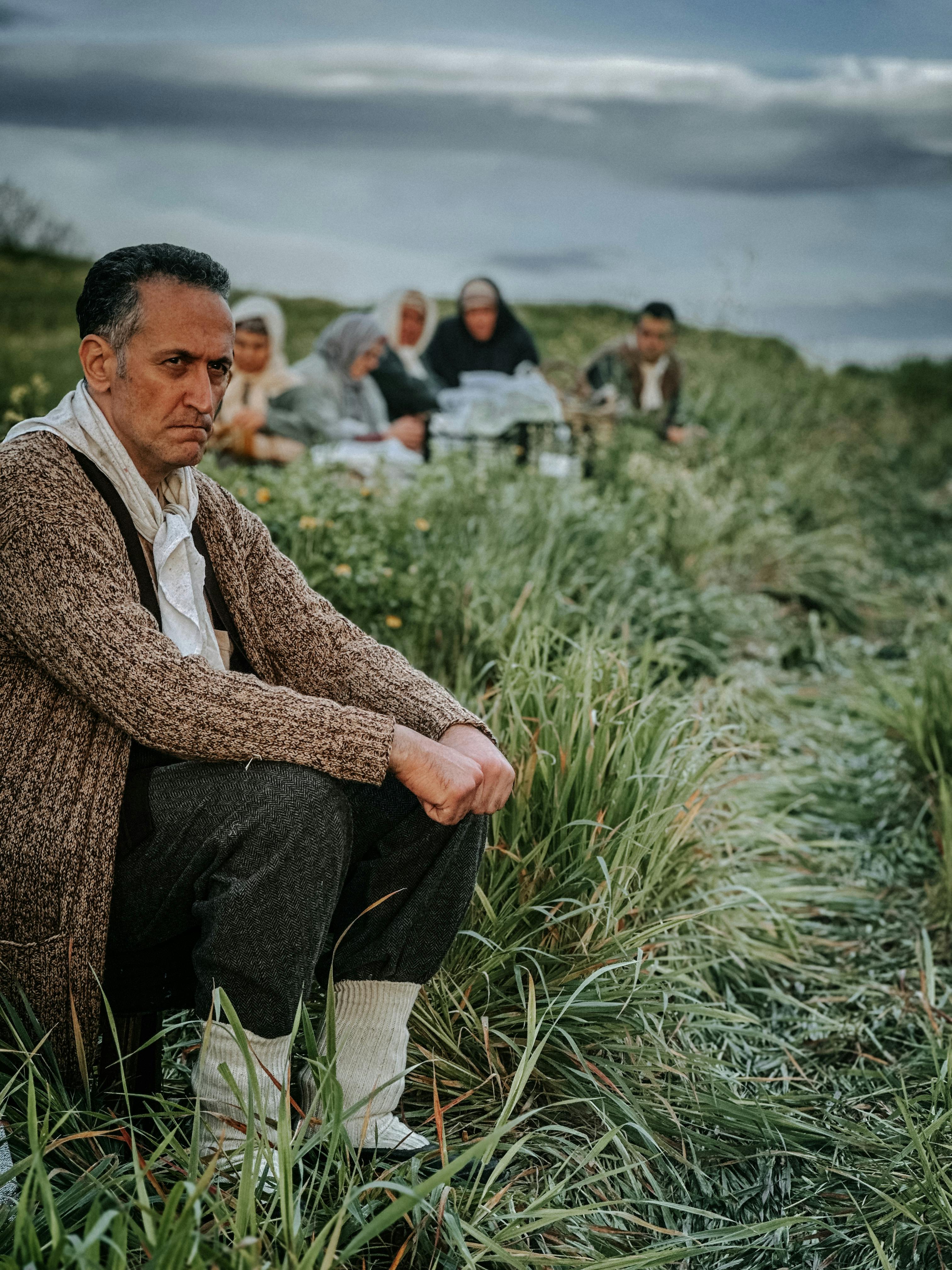 People Sitting in a Field · Free Stock Photo
