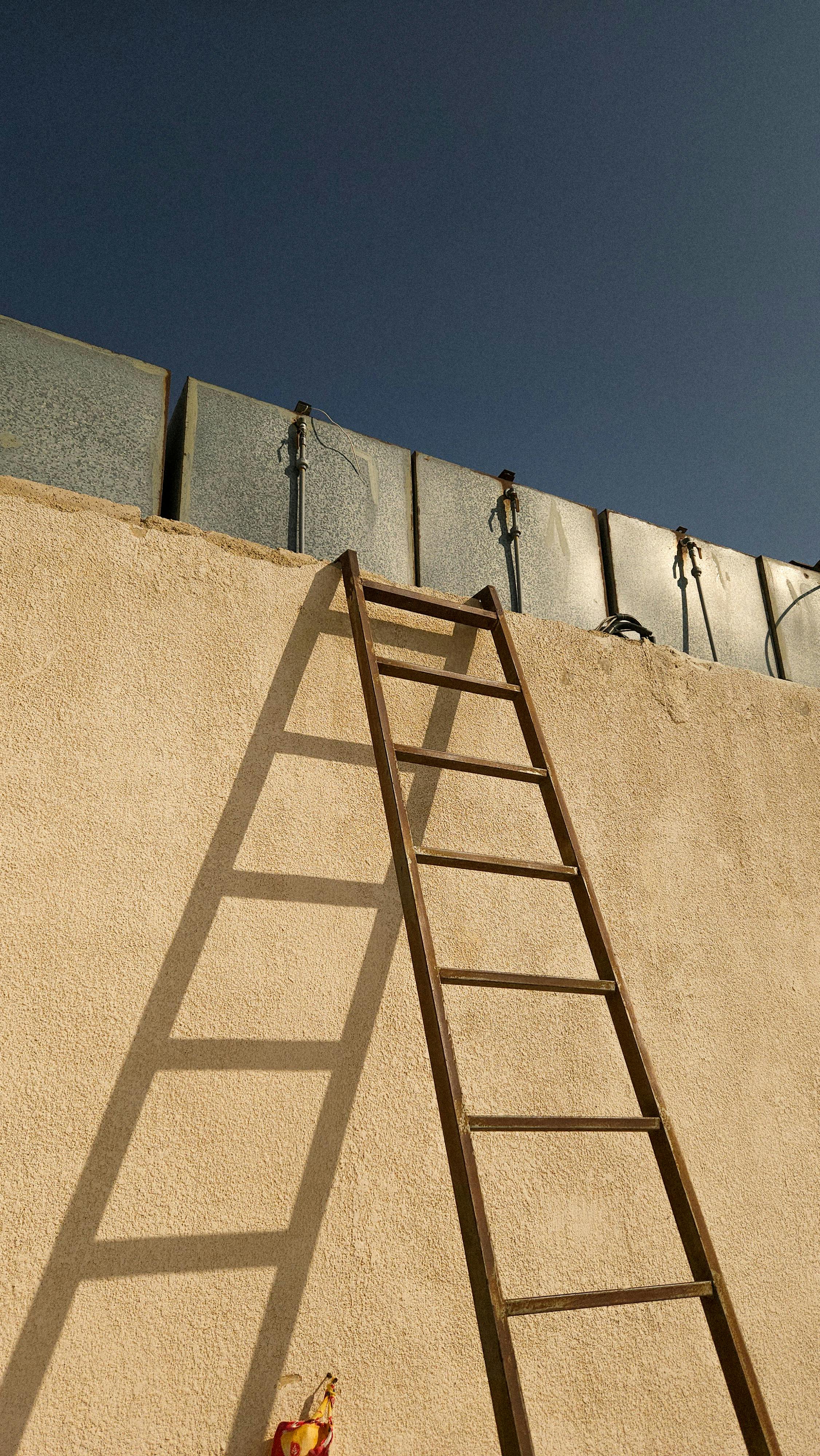 Wooden Ladder by the Wall of a Building with a Ventilation Duct on the ...