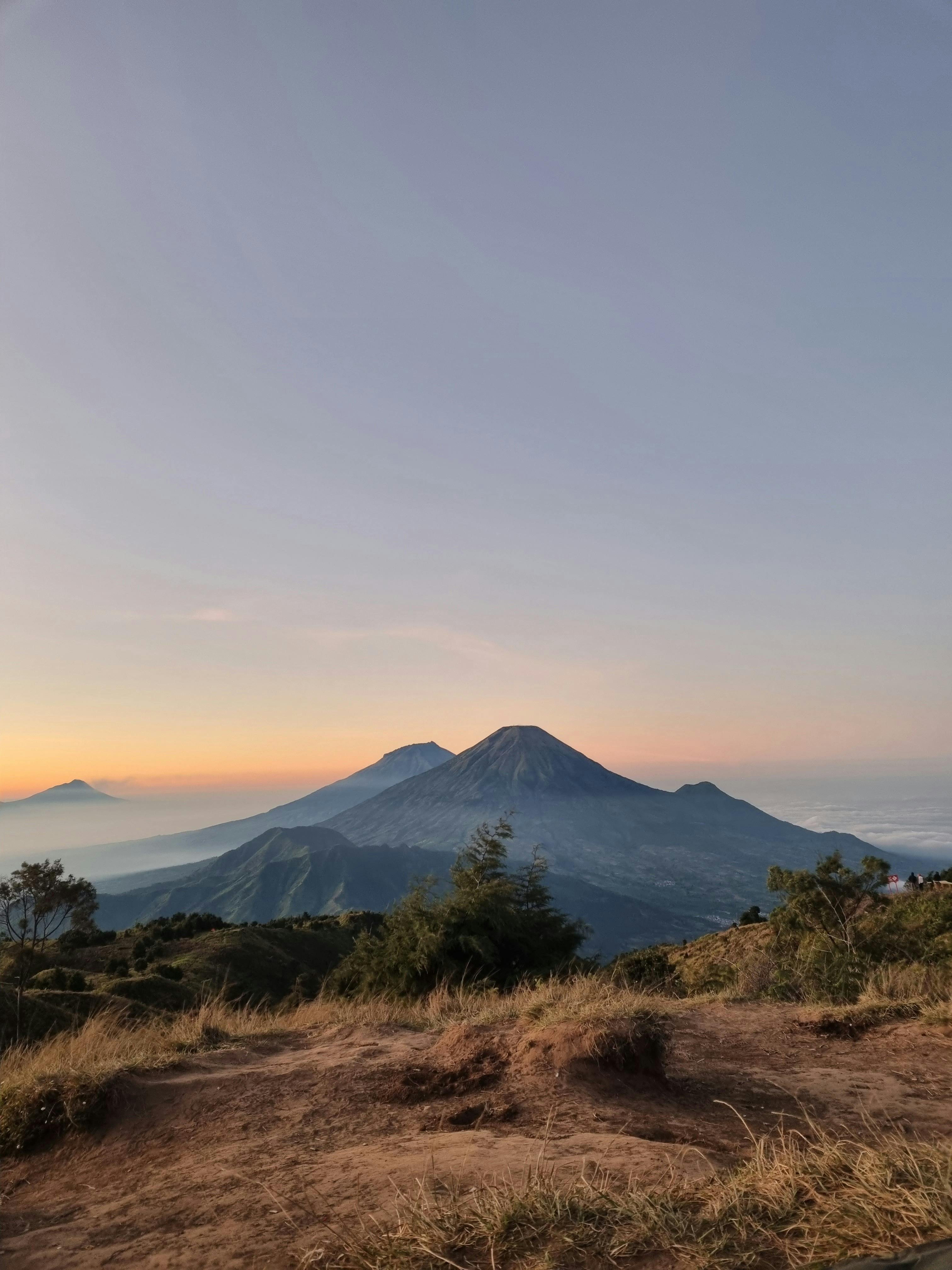 Panorama of Perahu Mountain in Fog at Sunrise, Indonesia · Free Stock Photo
