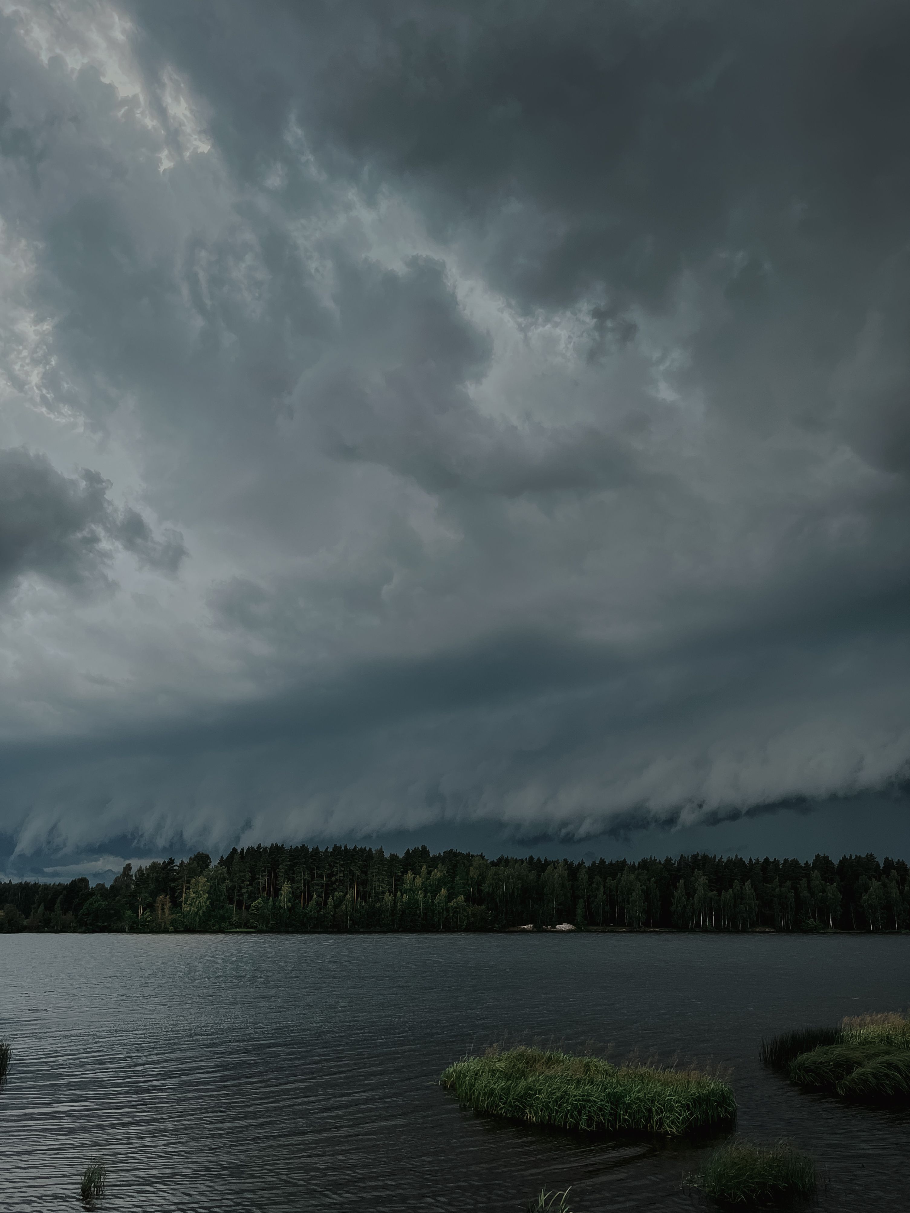 Dramatic Sky with Gray Storm Clouds over the Lake · Free Stock Photo