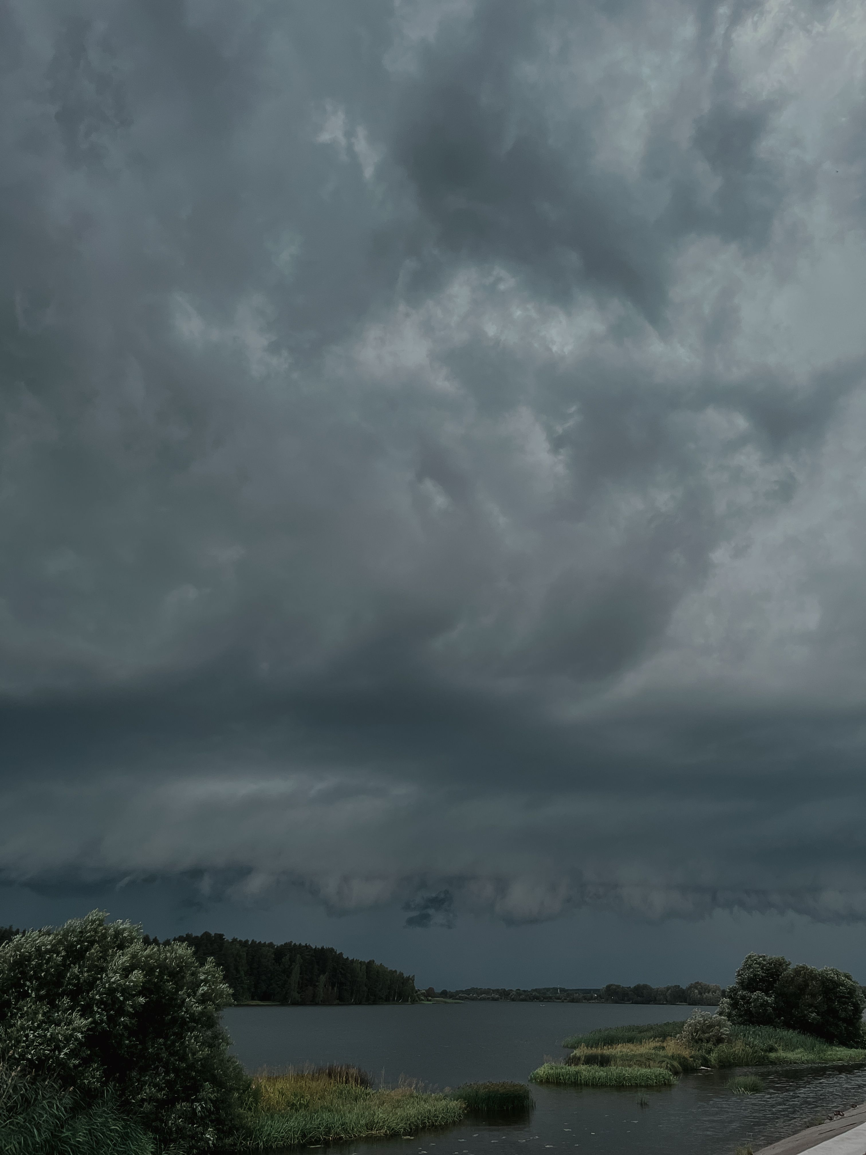 Dramatic Sky with Gray Storm Clouds over the Lake · Free Stock Photo