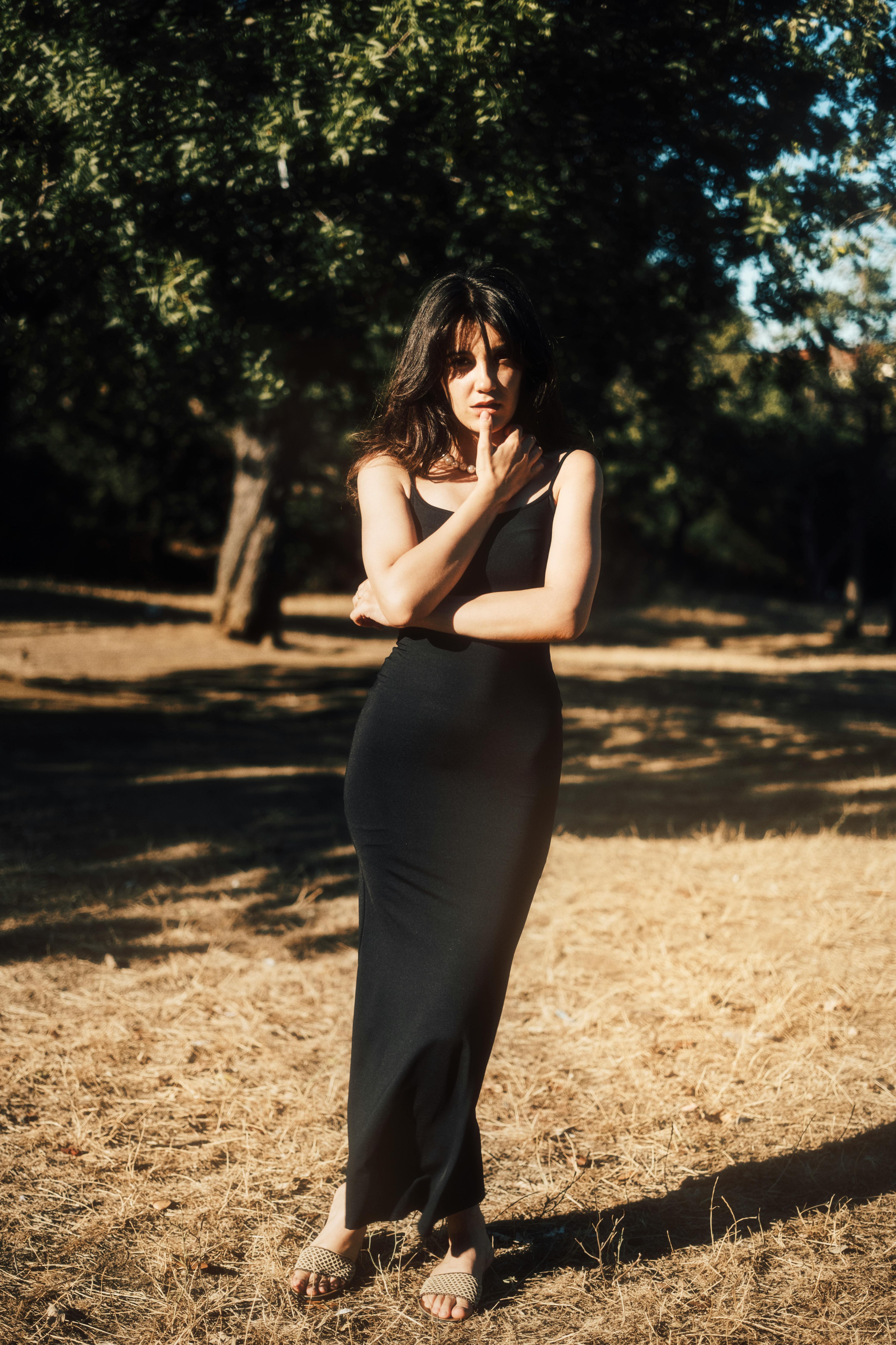 A Woman Posing by an Olive Tree · Free Stock Photo