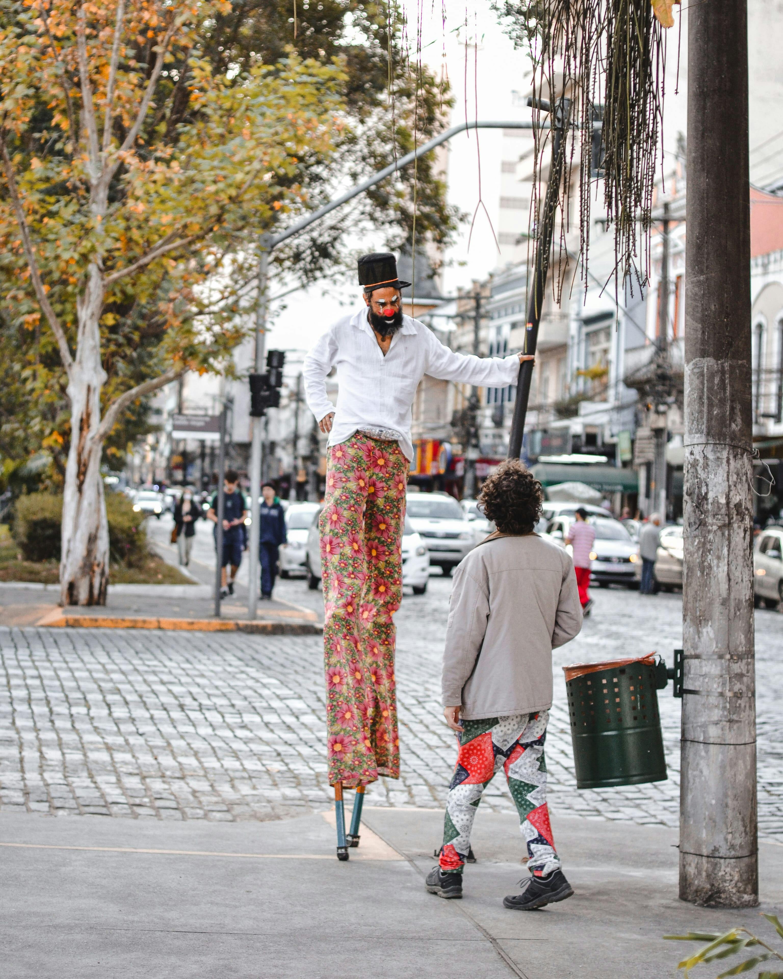 Performer on Stilts in Town · Free Stock Photo