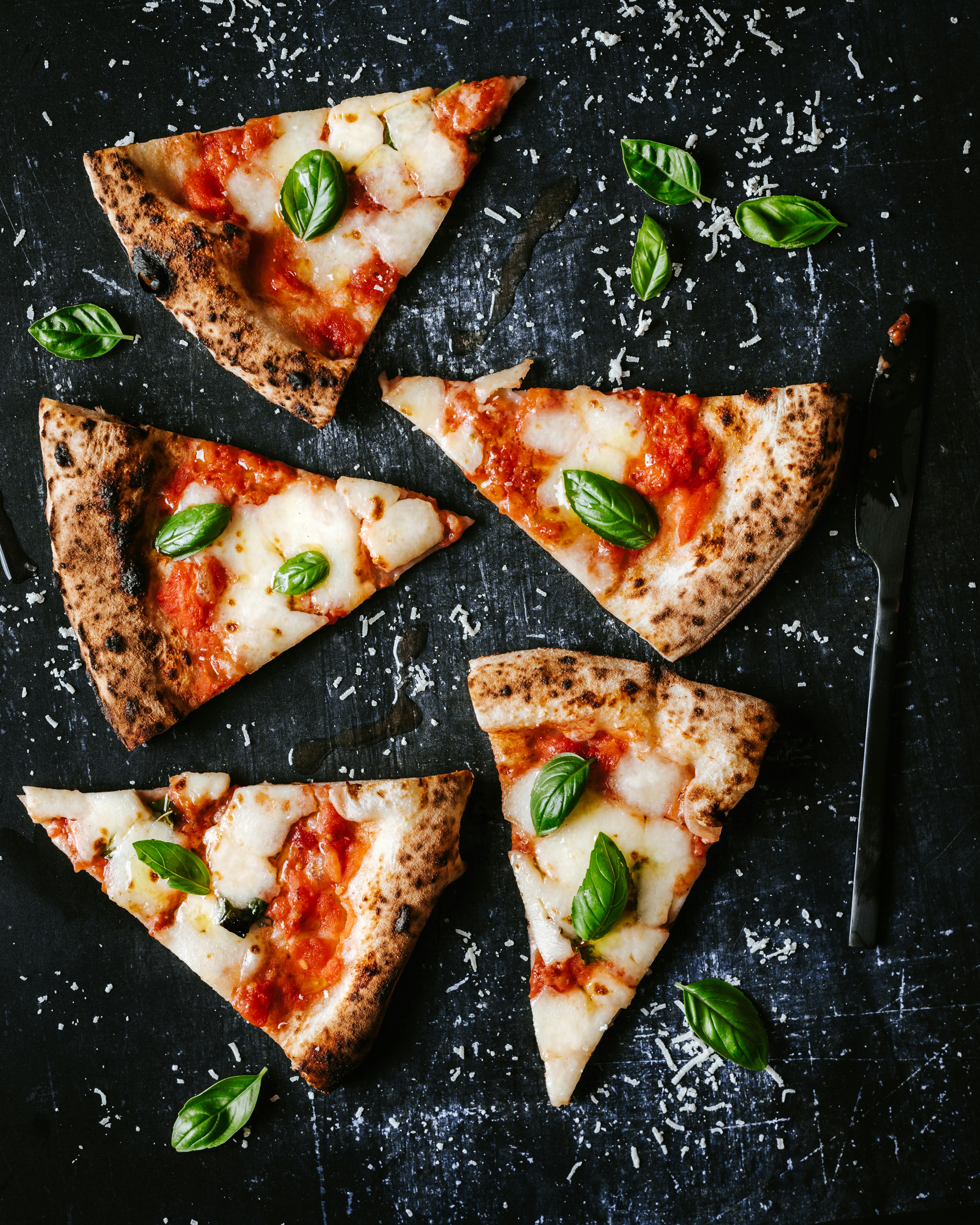 Pizza Slices on Black Background · Free Stock Photo