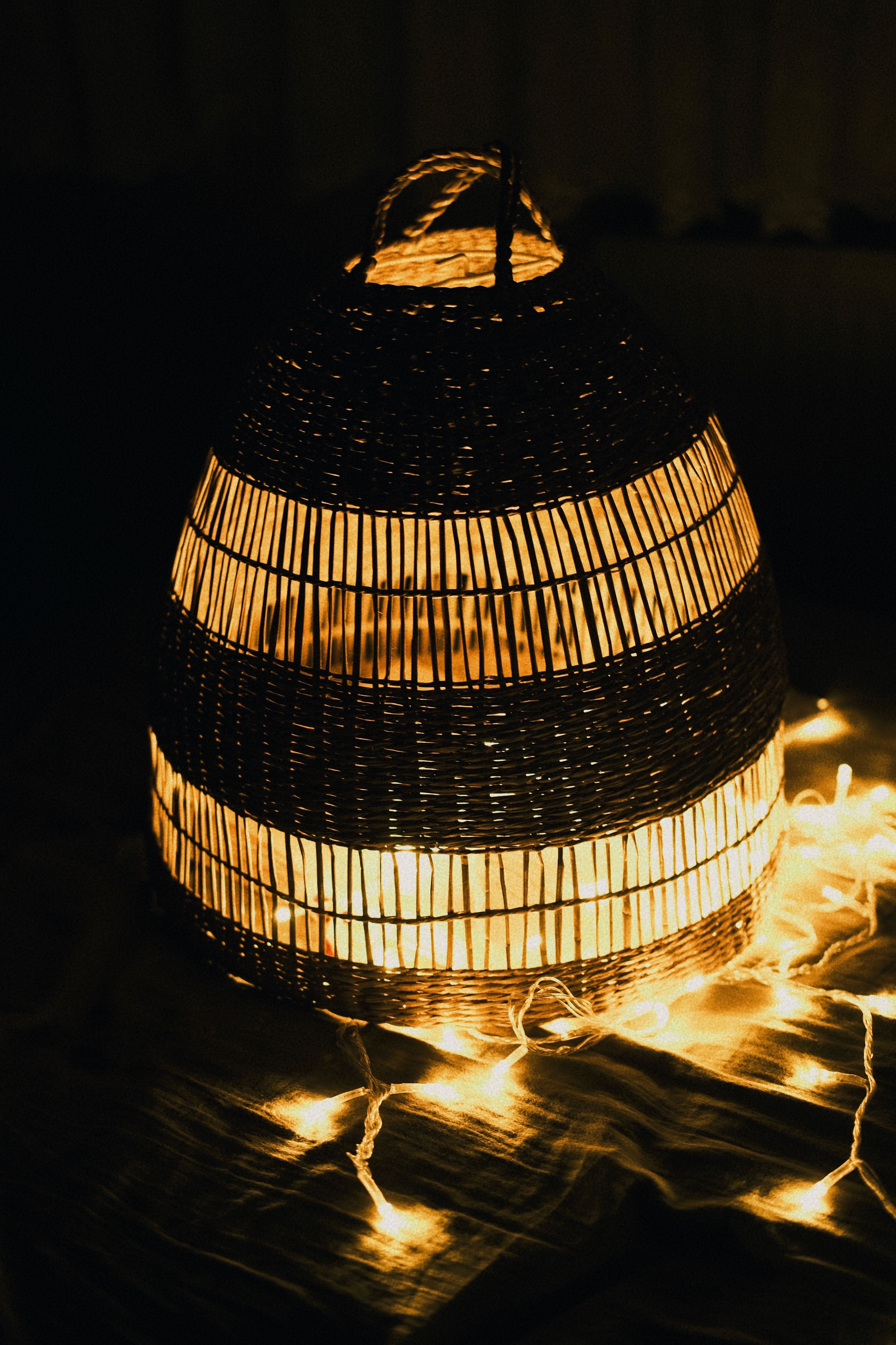 A Woven Lamp Shade with Fairy Lights Inside · Free Stock Photo