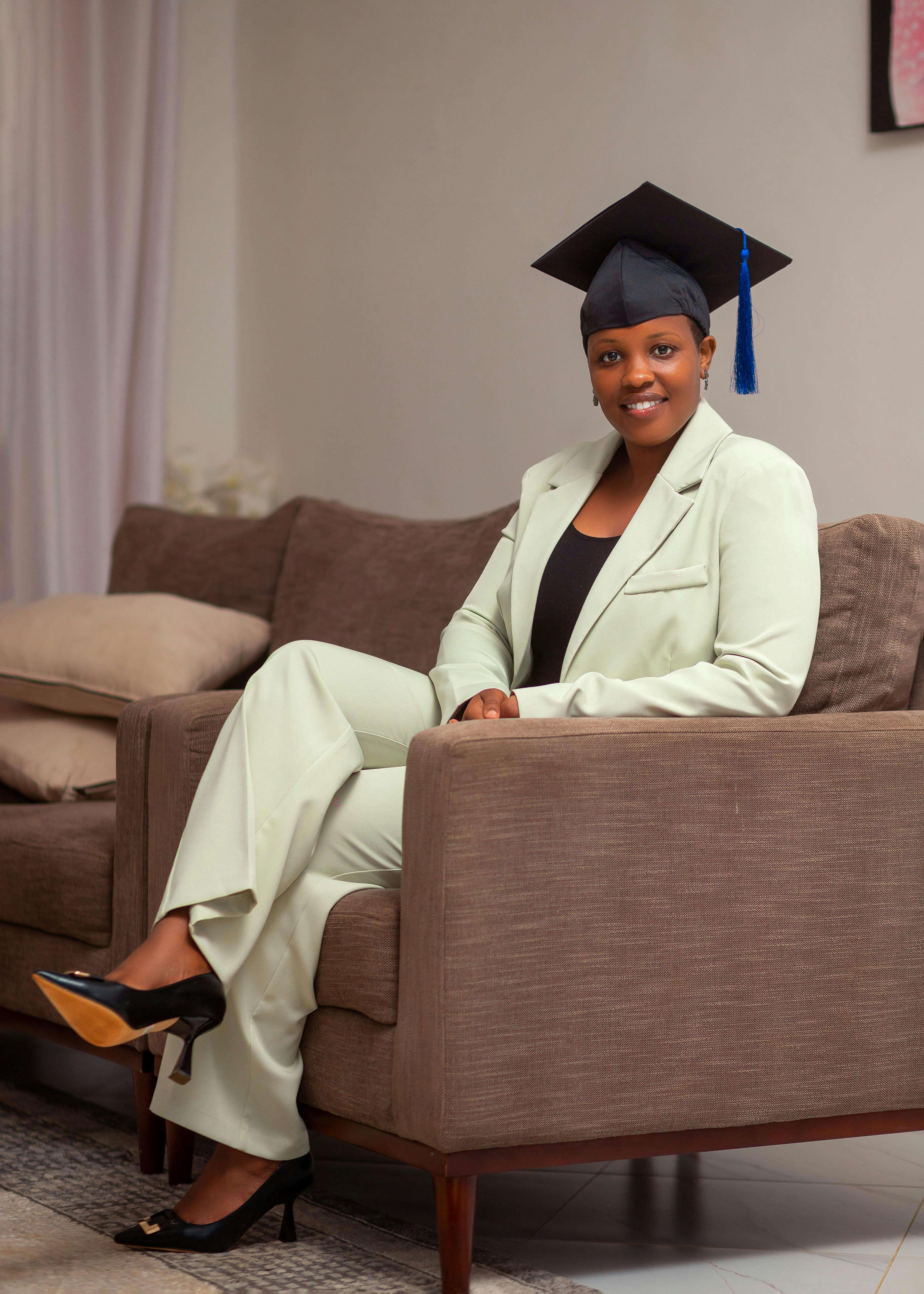 Woman in Elegant White Suit and Graduation Cap Sitting in Armchair ...