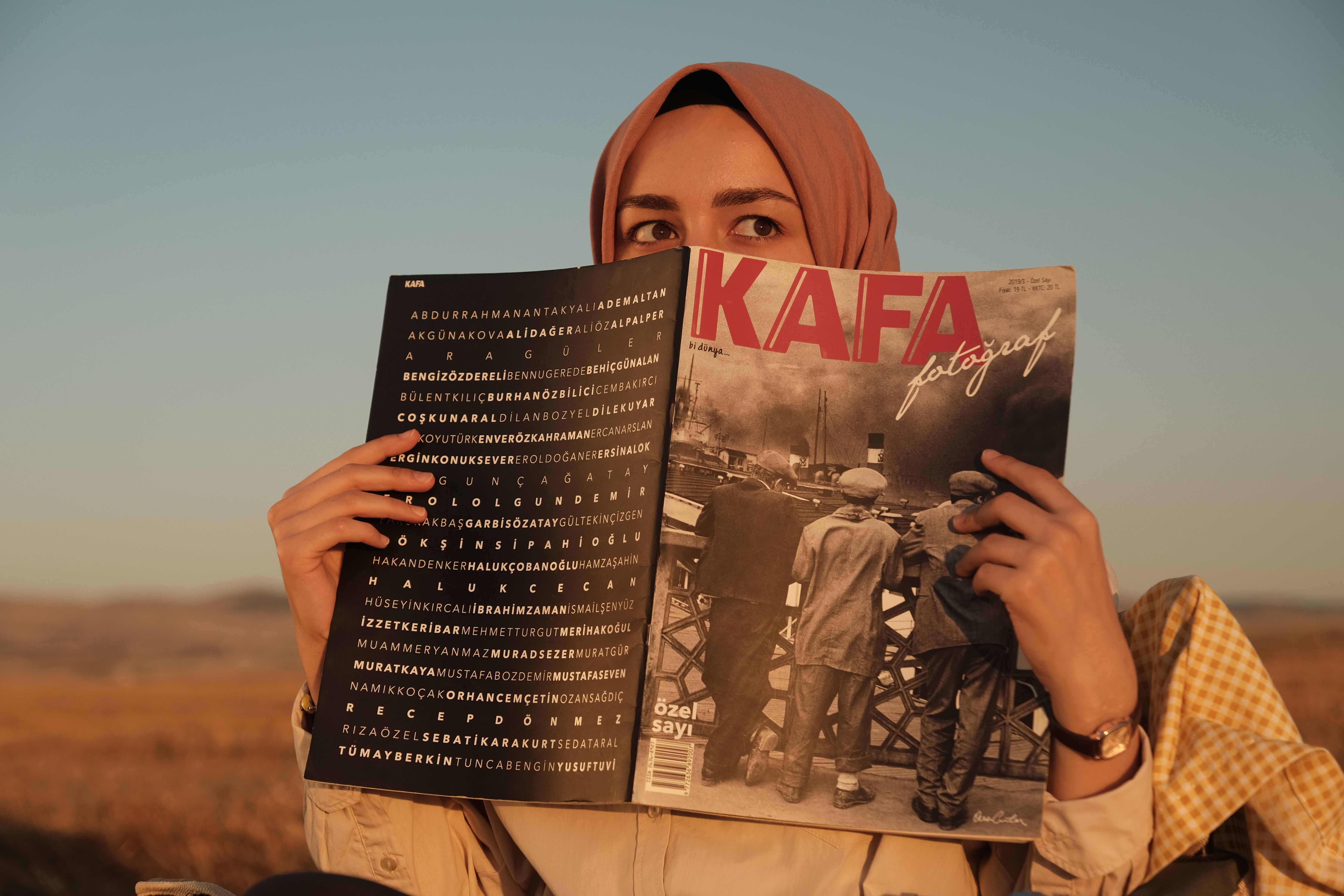 Woman Holding Turkish Magazine · Free Stock Photo